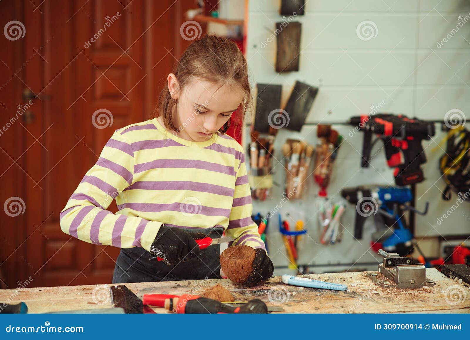Creative Student Doing His Project in Workshop. Boy in the Workshop Makes Crafts with Coconut ...