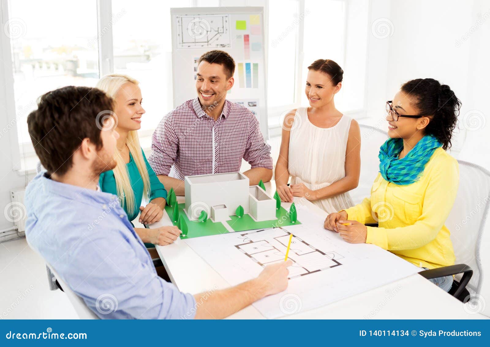 Creative Team with Blueprint Working at Office Stock Photo - Image of ...
