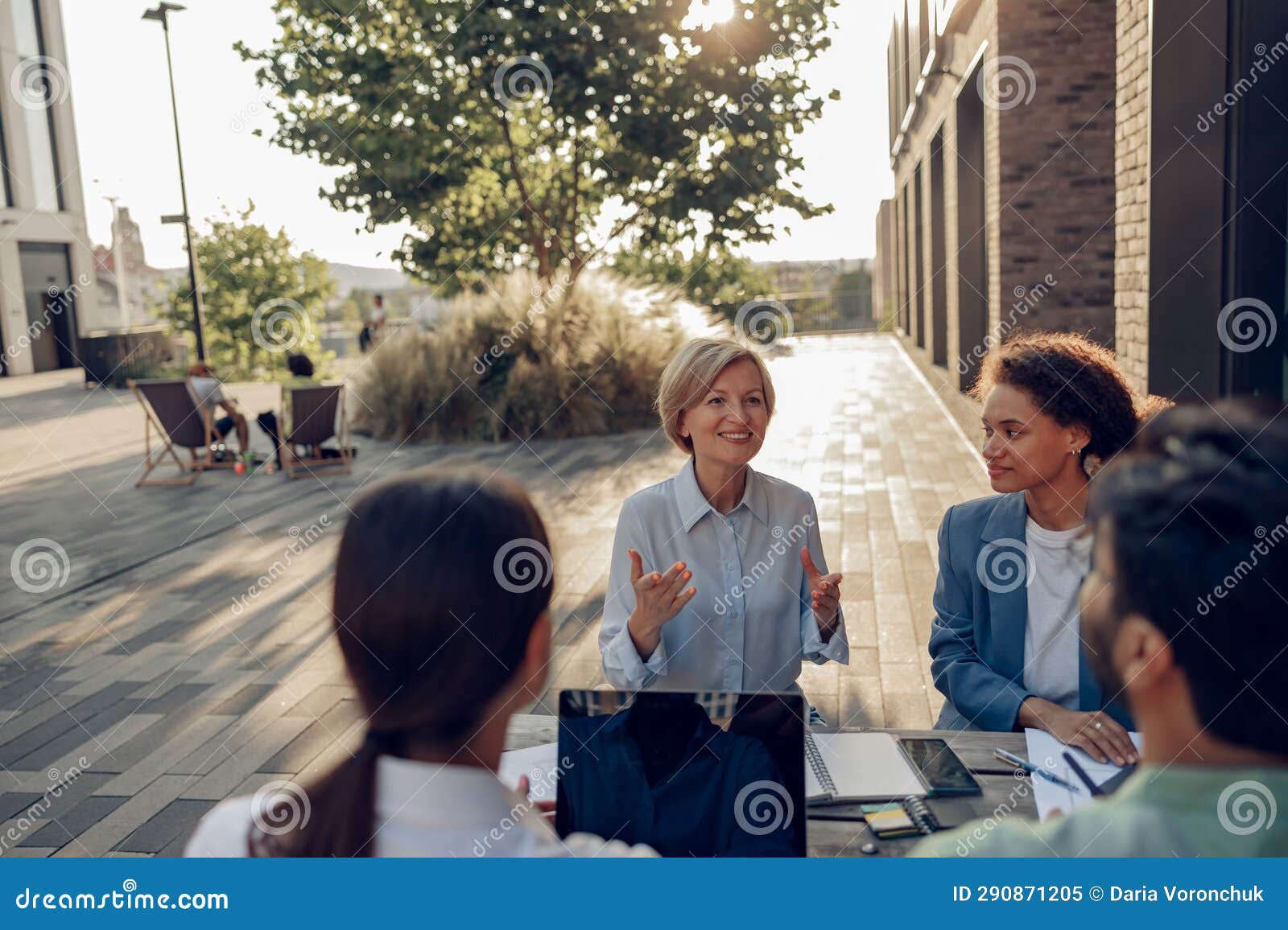Group of Office Workers Working on the Terrace of the Office. Teamwork ...