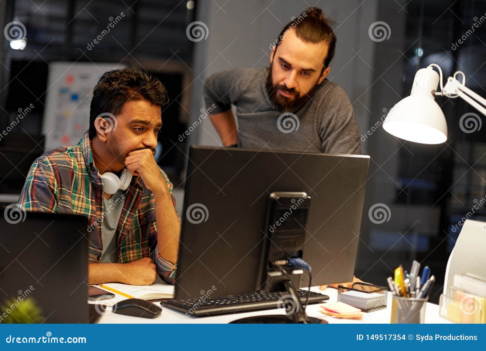 Creative Team with Computer Working Late at Office Stock Photo - Image ...