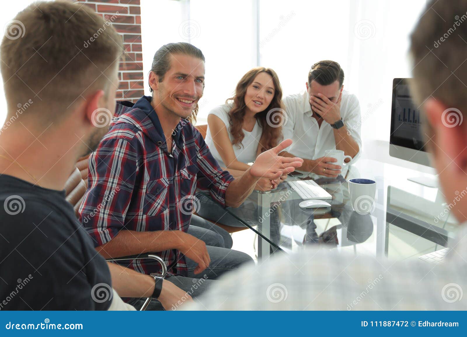 Creative Team Discussing Business Issues Sitting Stock Photo - Image of ...