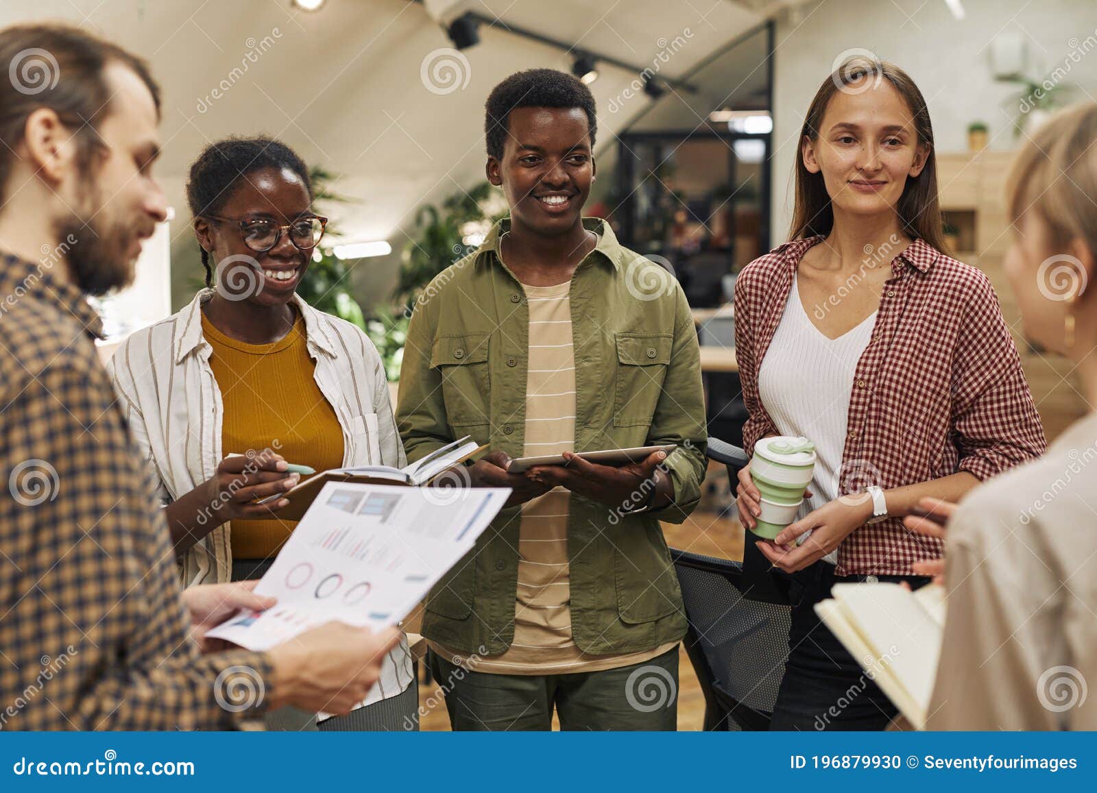 Creative Team Discussing Project in Office Stock Photo - Image of ...