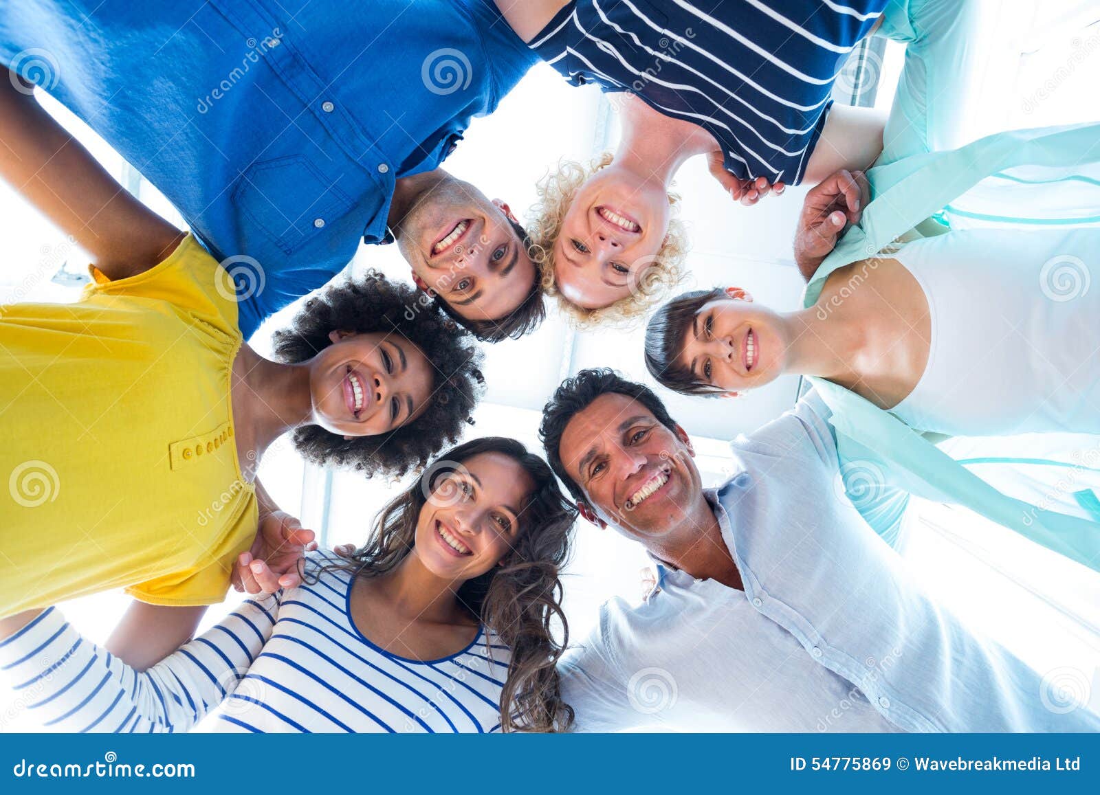 Creative Team Forming Huddle Stock Image - Image of bonding, standing ...