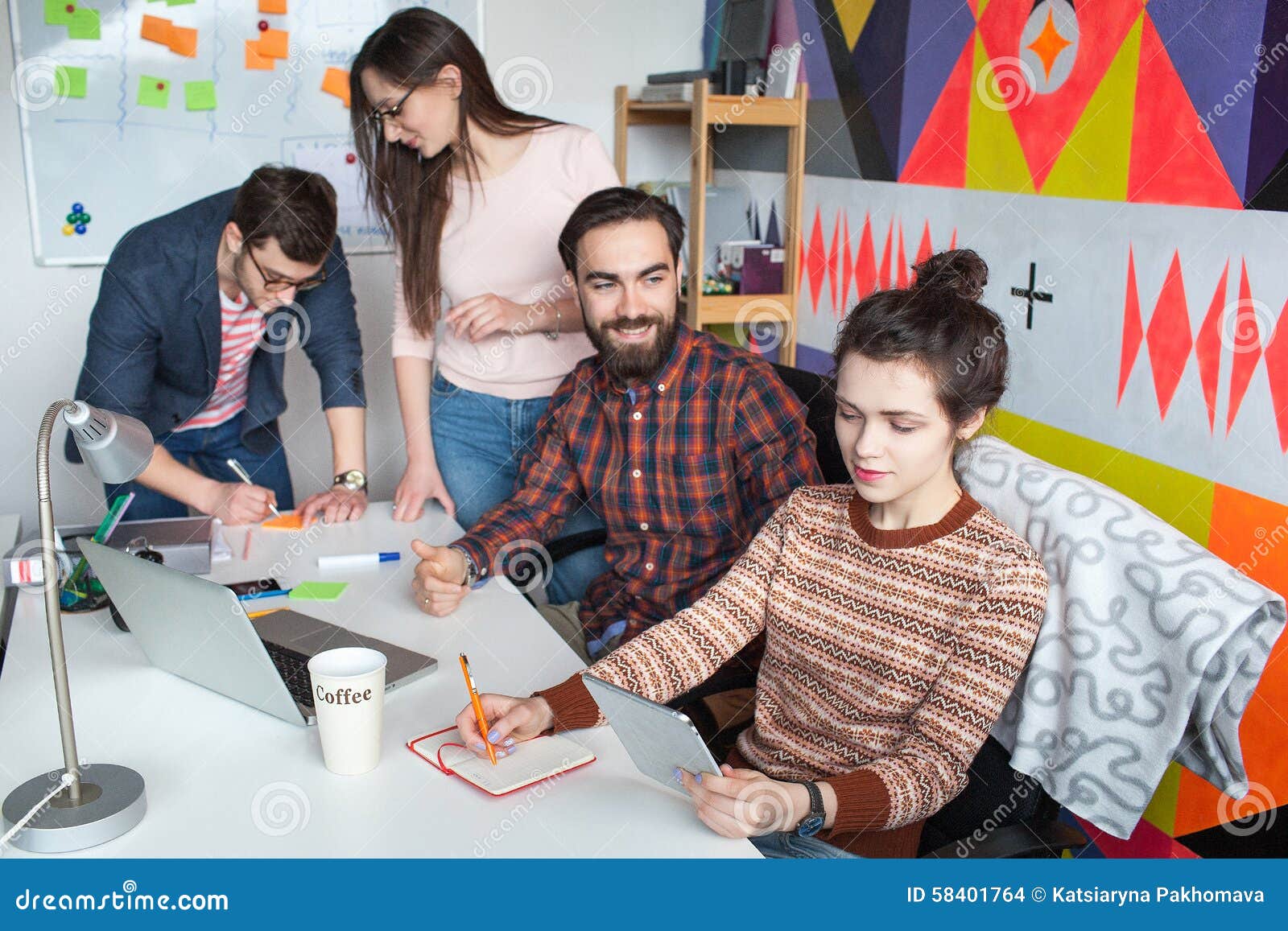 Creative Team of Four Colleagues Working in Modern Office Stock Photo ...