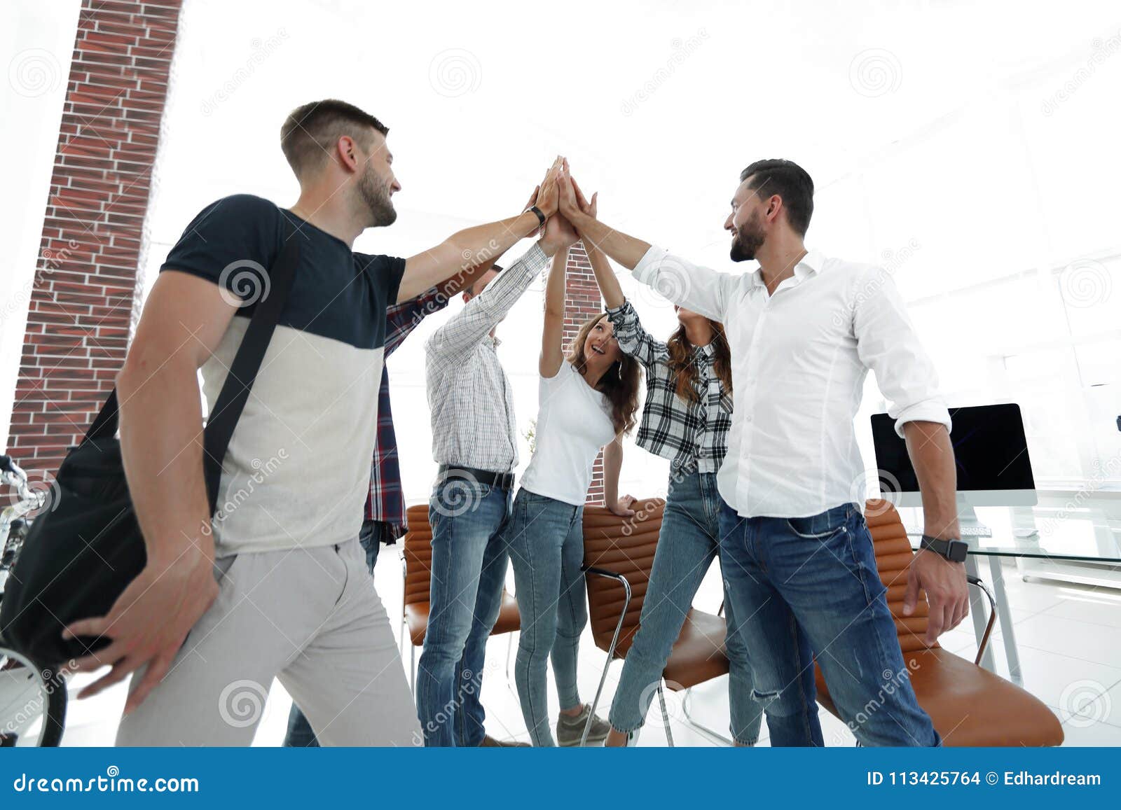 Creative Team Giving Each Other a High Five Stock Photo - Image of ...