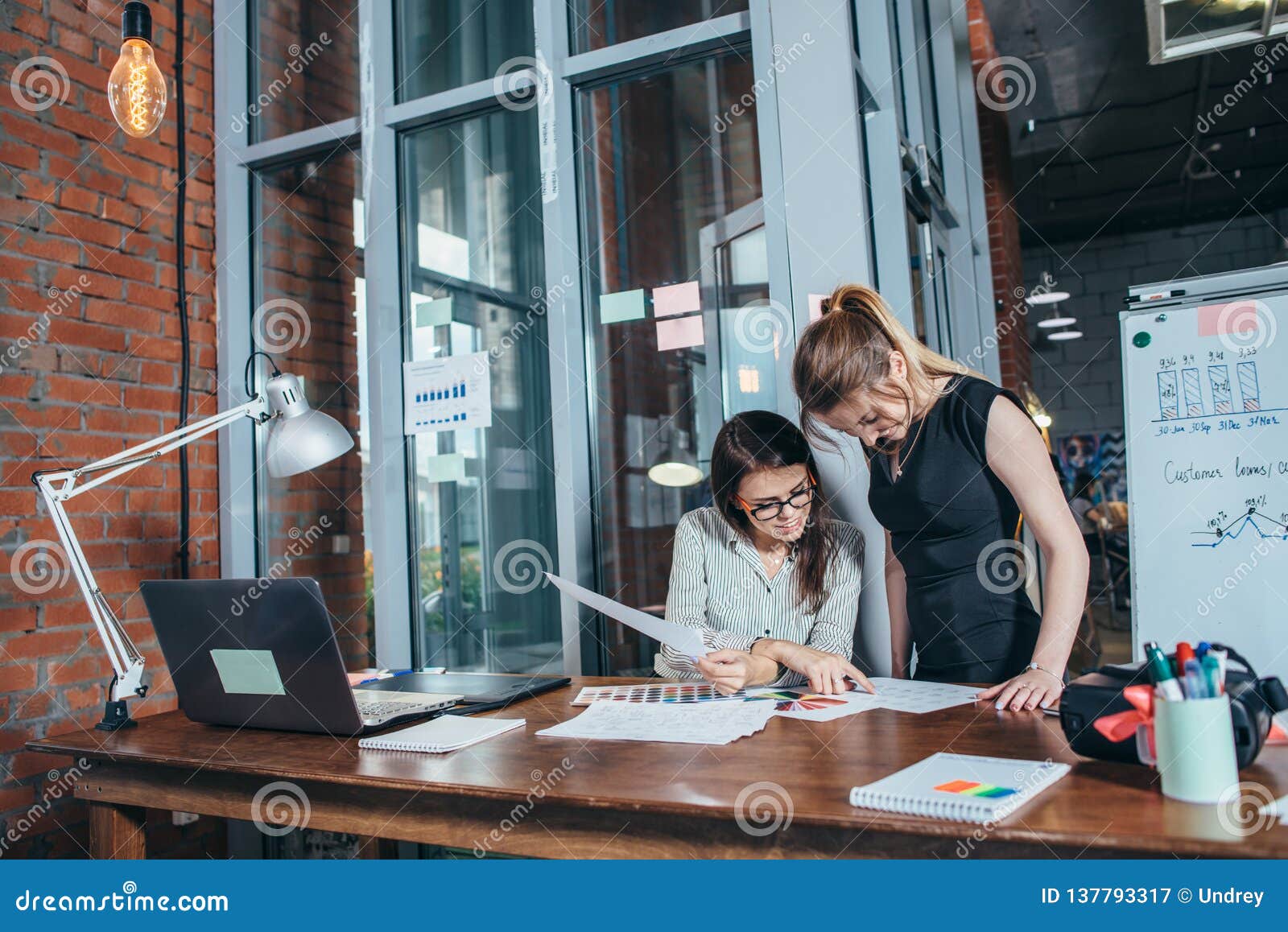 Creative Team of Graphic Designers Working on New Project Using Color ...