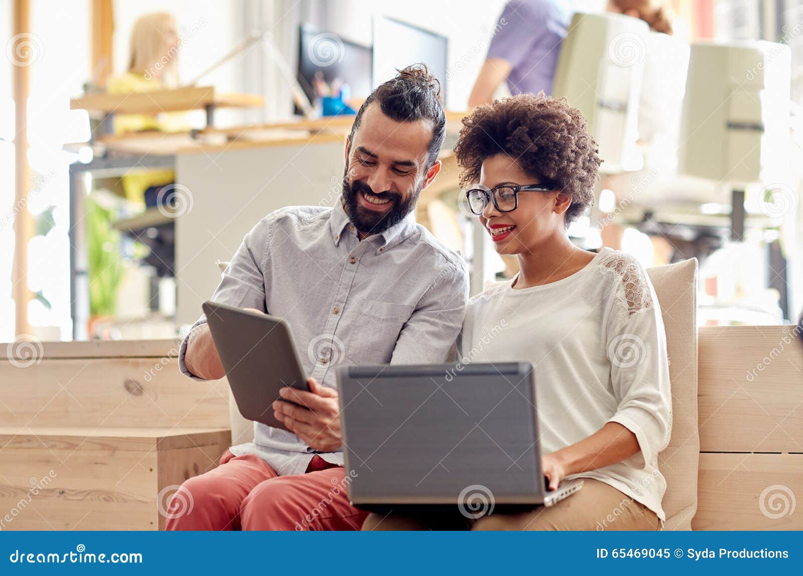 Creative Team with Laptop and Tablet Pc in Office Stock Image - Image ...