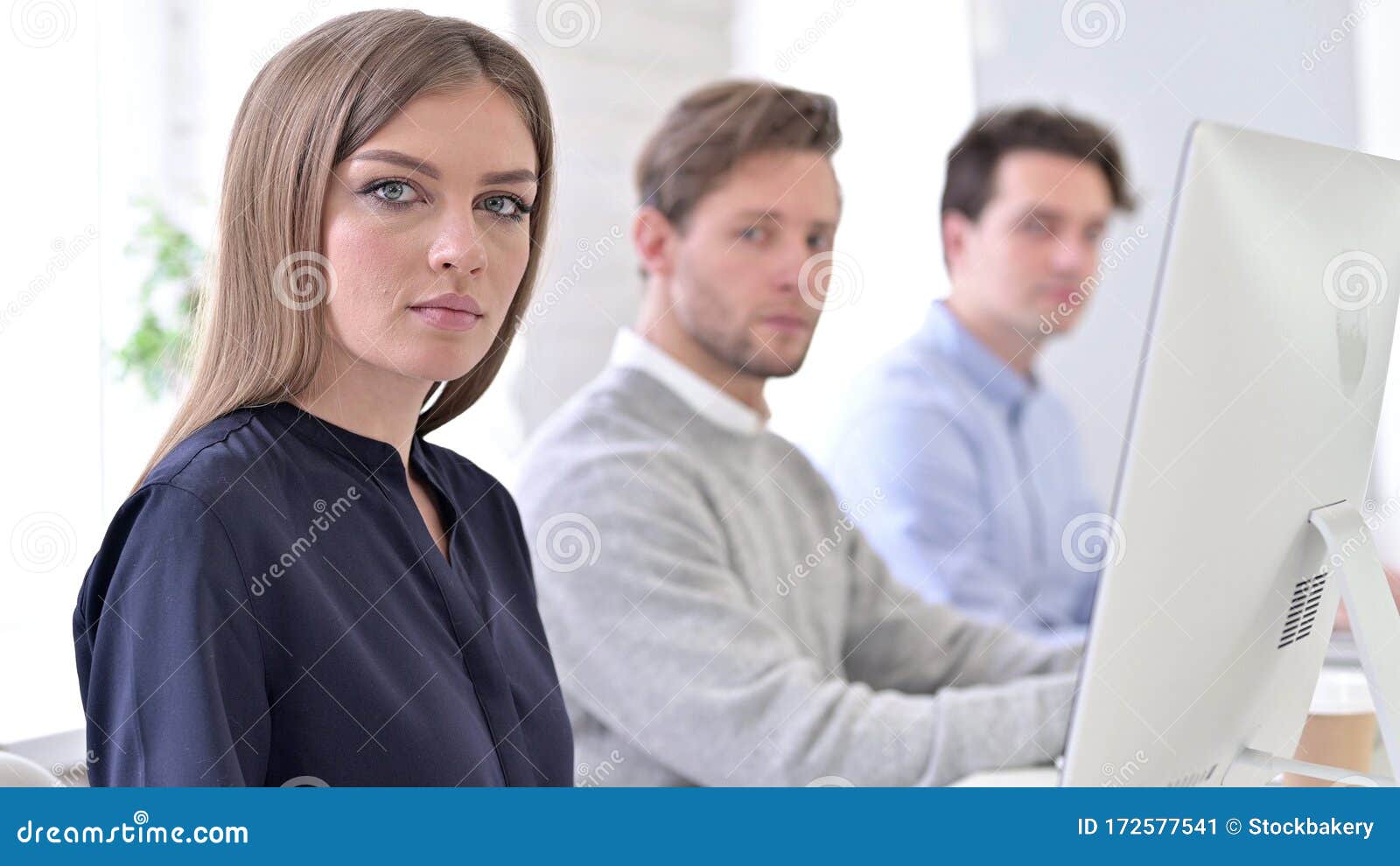 The Creative Team at Work Looking at the Camera Stock Image - Image of ...