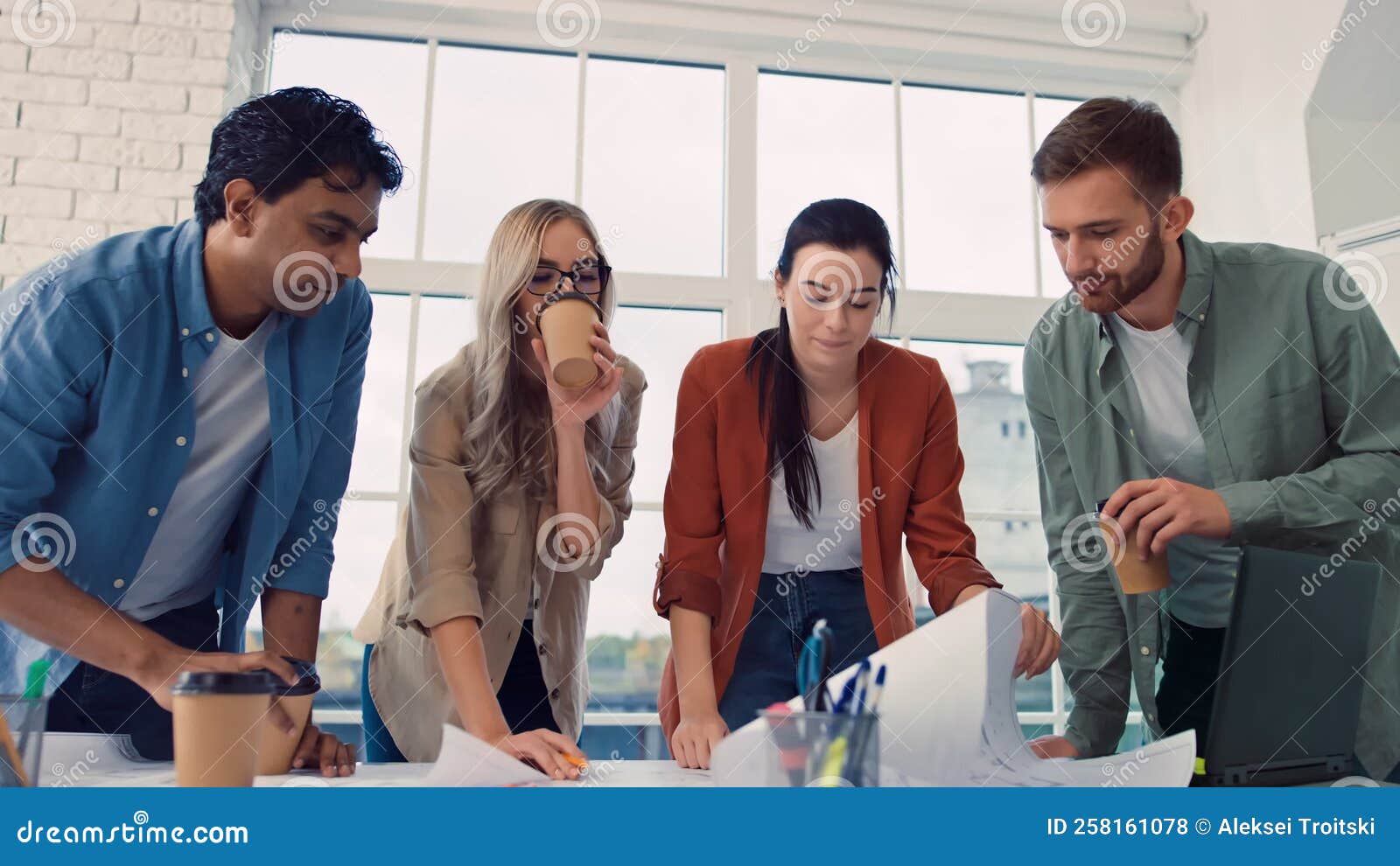 Creative Team Working on Table. Creative Office Work. Team Discussing ...