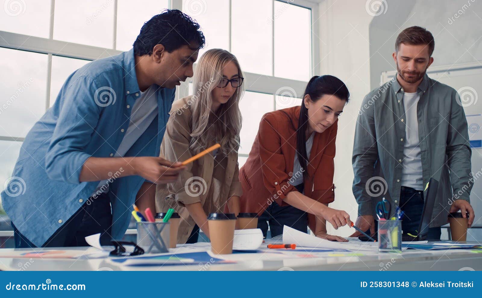 Creative Team Working on Table. Creative Office Work. Team Discussing ...