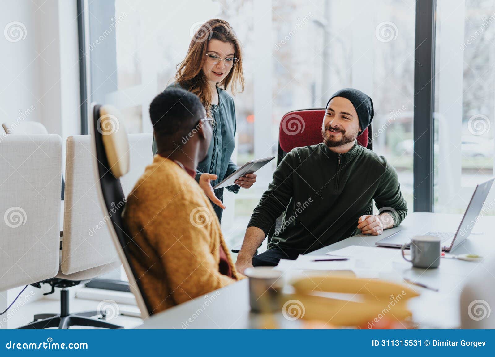 Diverse Team Collaborating in Innovative Office, Discussing Strategies ...