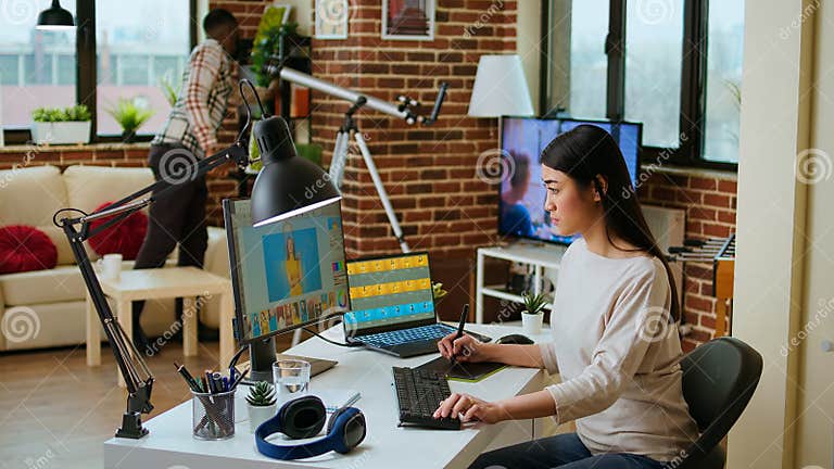 Creative Woman Manages Photo Editing and Design Projects on Her ...