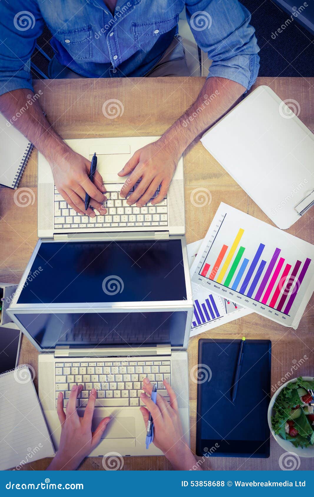 Creative Workers Sharing Desk Stock Photo - Image of casual, desk: 53858688