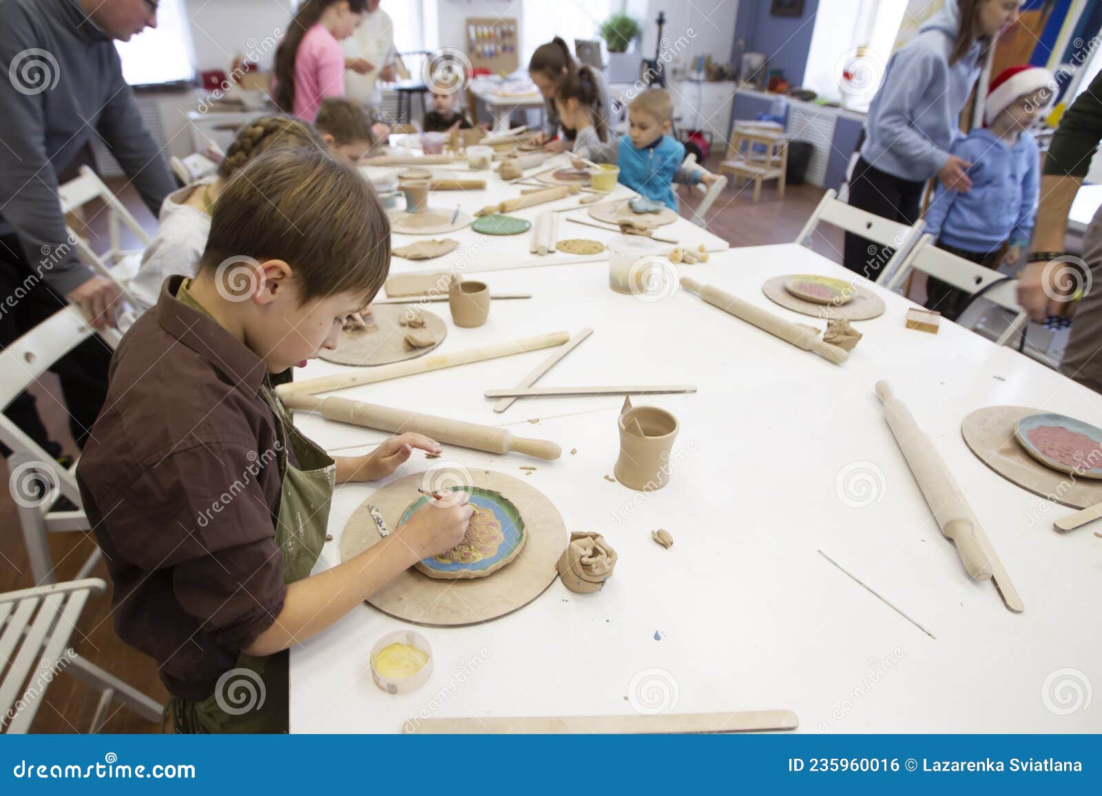 Creative Workshop. A Group Of Children At A Clay Modeling Master Class ...