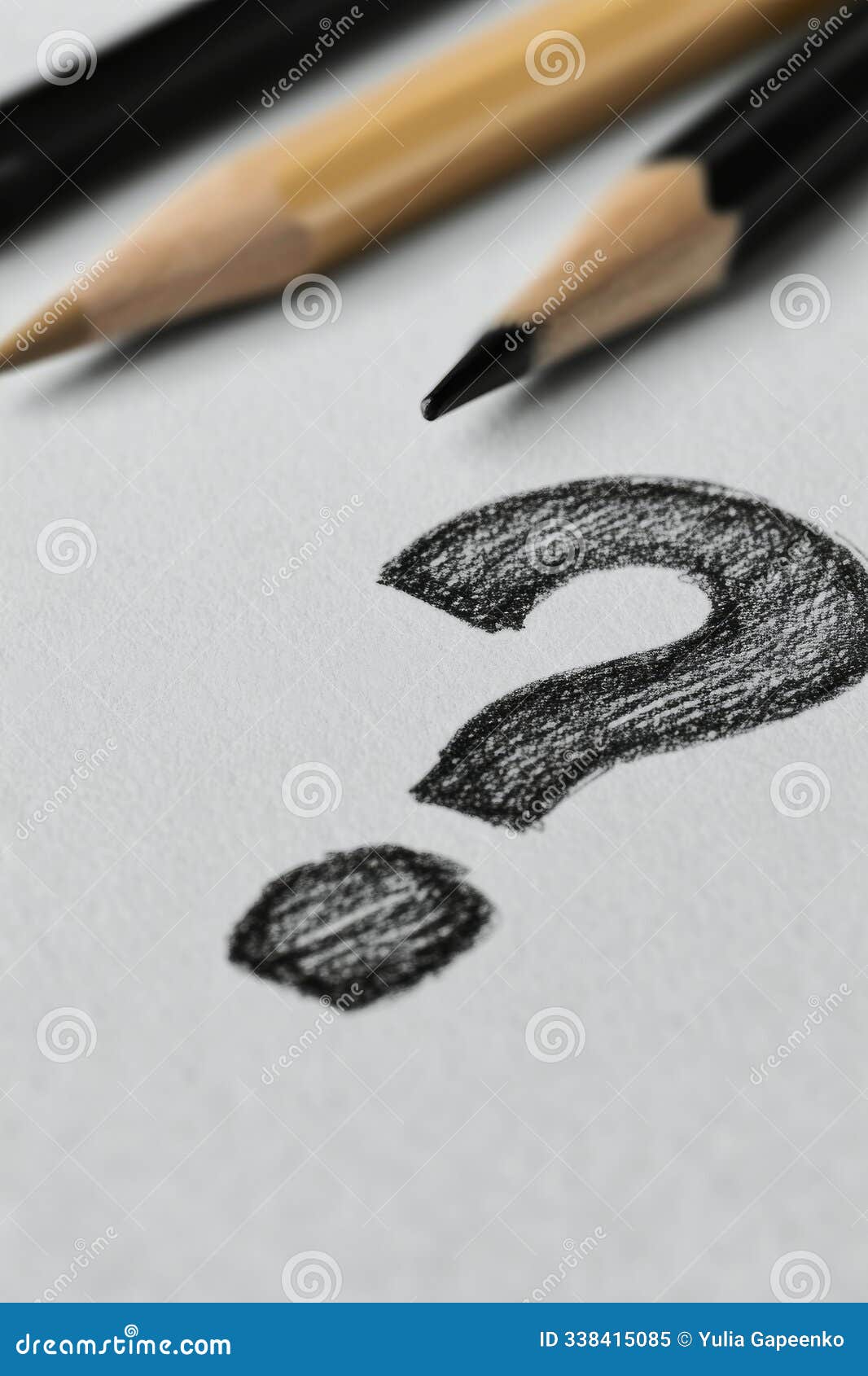 Creative Workspace with a Question Mark Drawn in Charcoal among Pencils ...