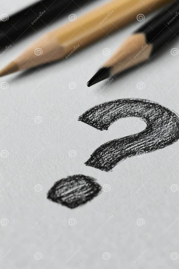 Creative Workspace with a Question Mark Drawn in Charcoal among Pencils ...