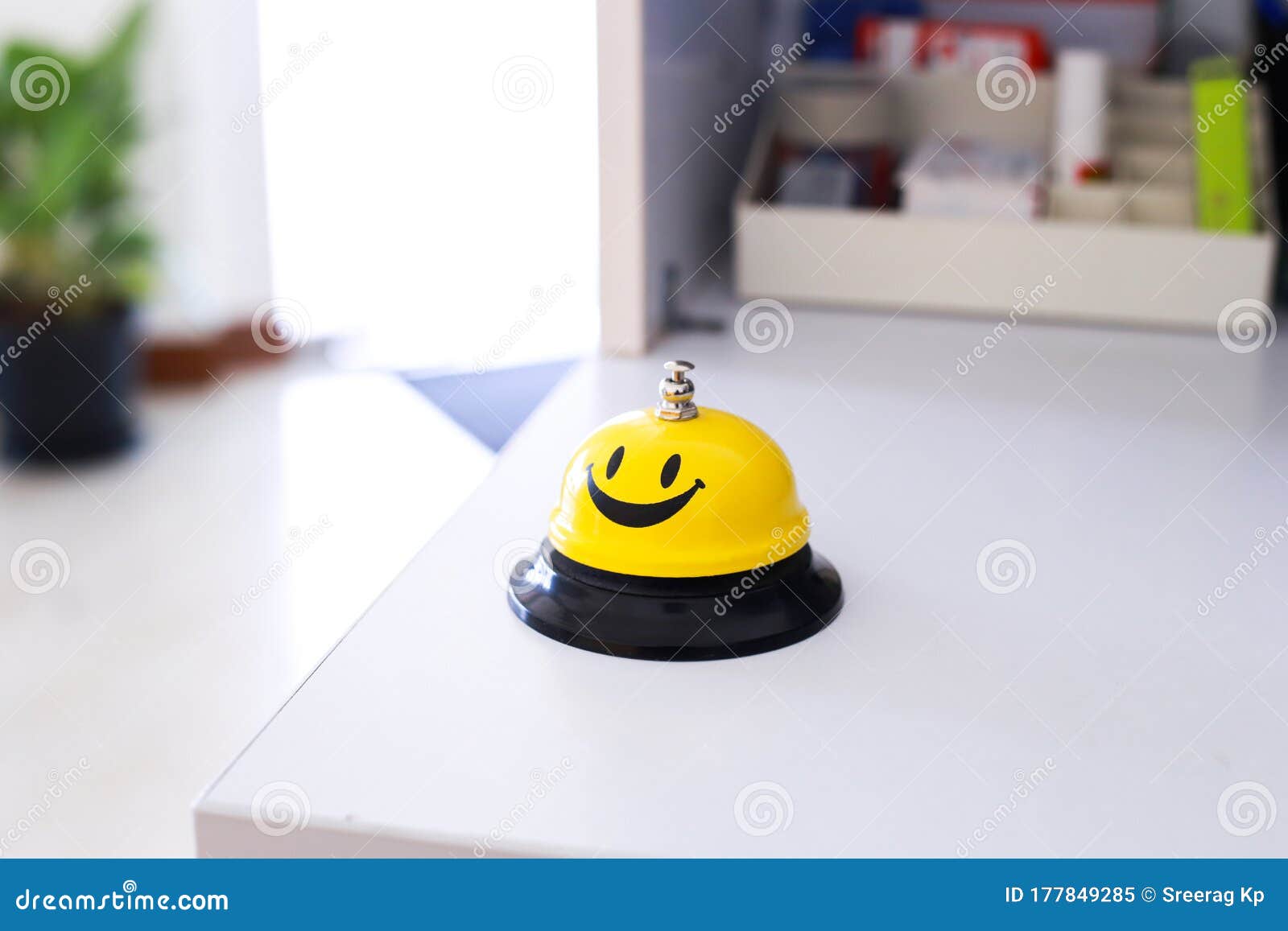 Creative Yellow Smiley Bell on Table, Smiley Bell Stock Image - Image ...
