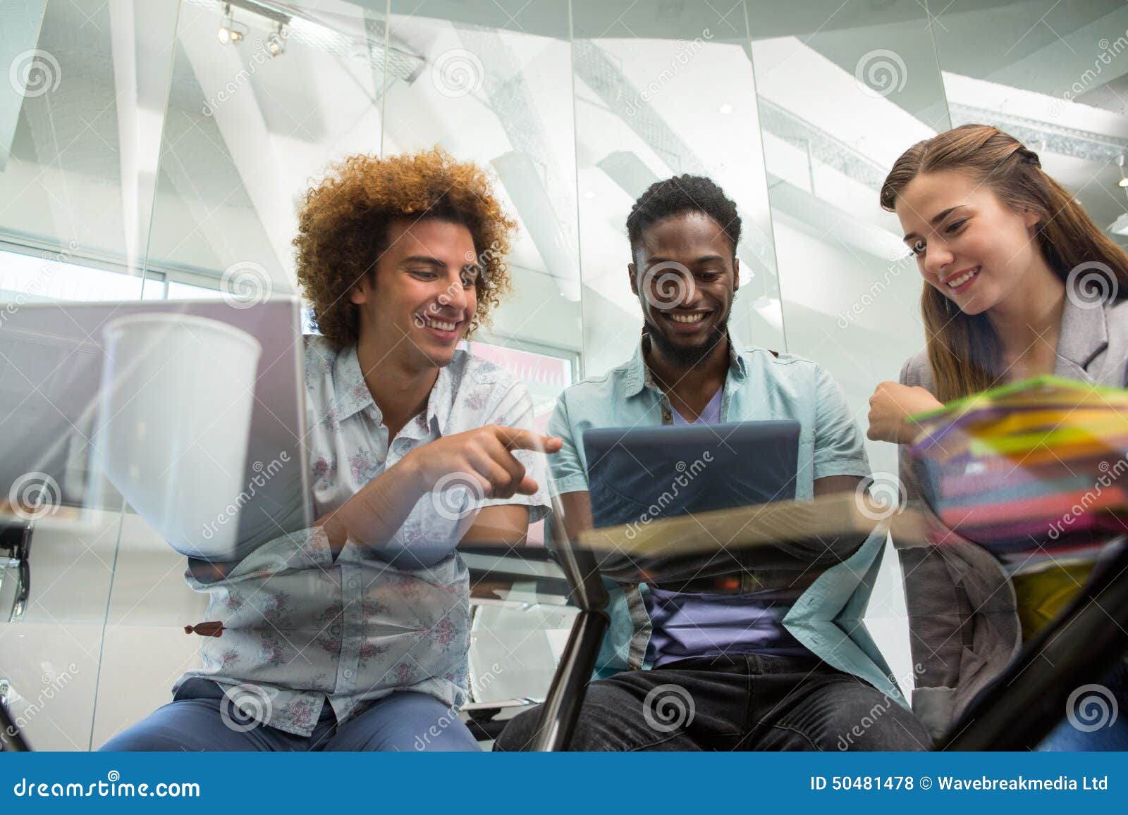 Creative Young Business People Looking at Digital Tablet Stock Photo ...