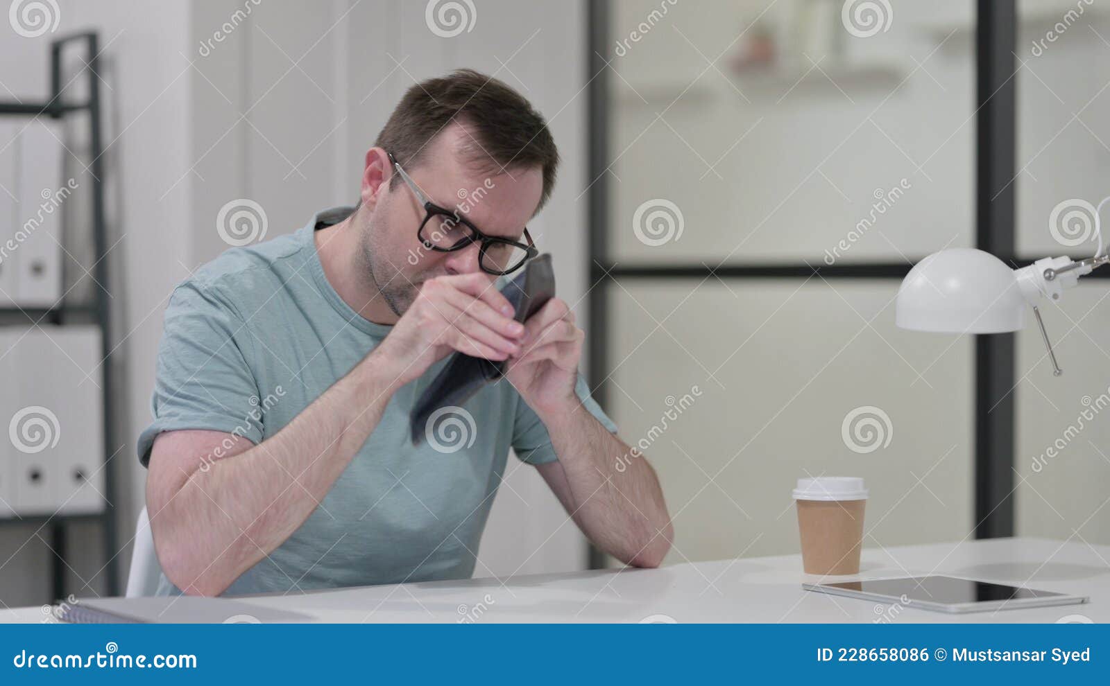 Young Man Checking Empty Wallet at Work Stock Photo - Image of buying ...