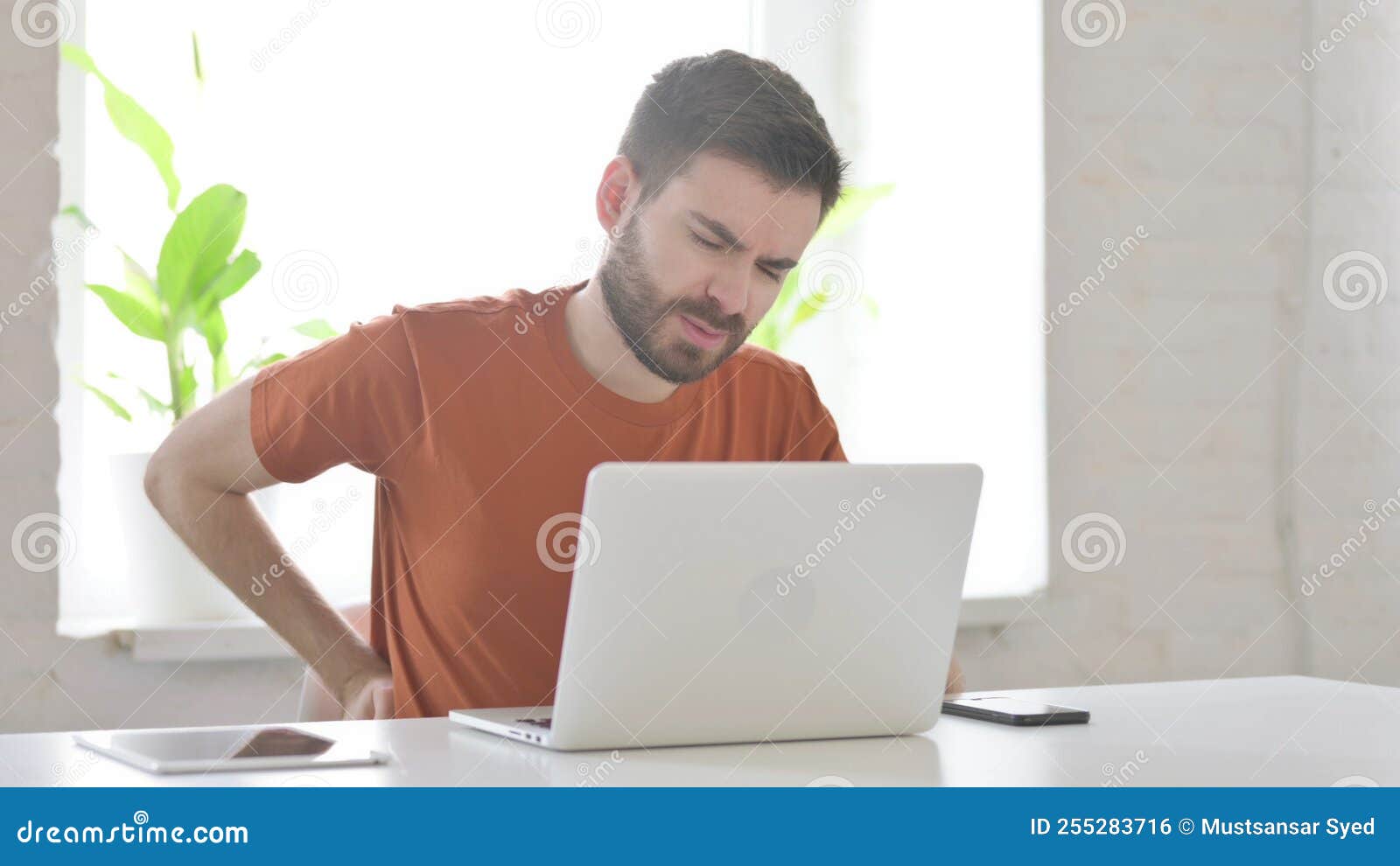 Young Man Having Back Pain at Work Stock Photo - Image of pain, tired ...