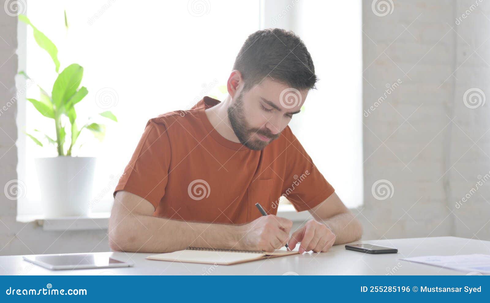 Young Man Writing Letter in Office Stock Photo - Image of writing ...