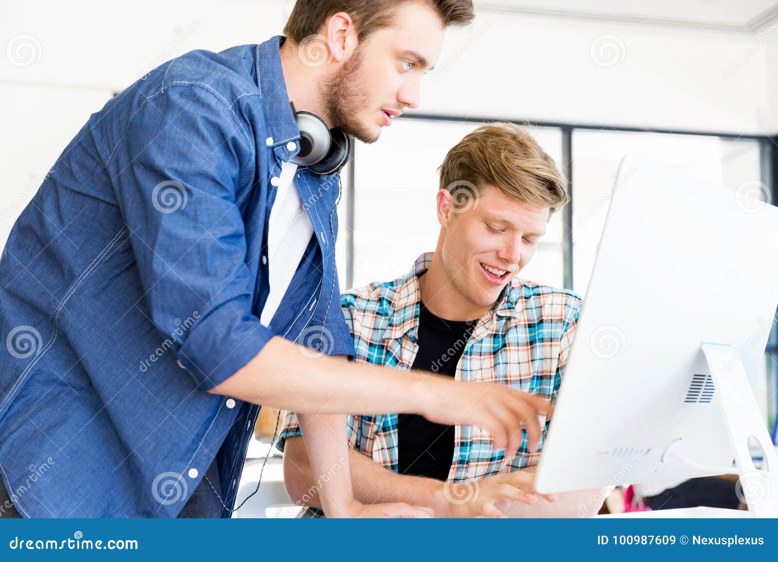 Young Office Workers Discussing Stock Image - Image of contemporary ...