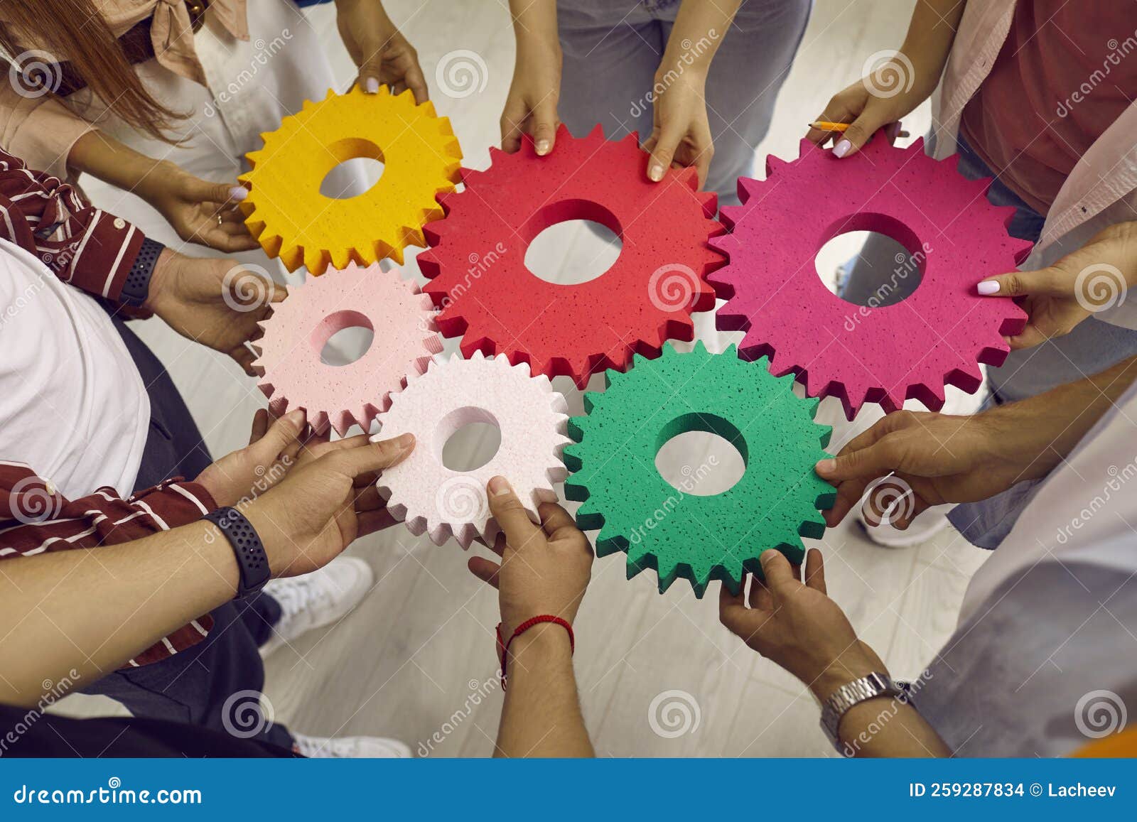 Creative Young People Hold Colored Gears of Different Sizes Symbolizing ...