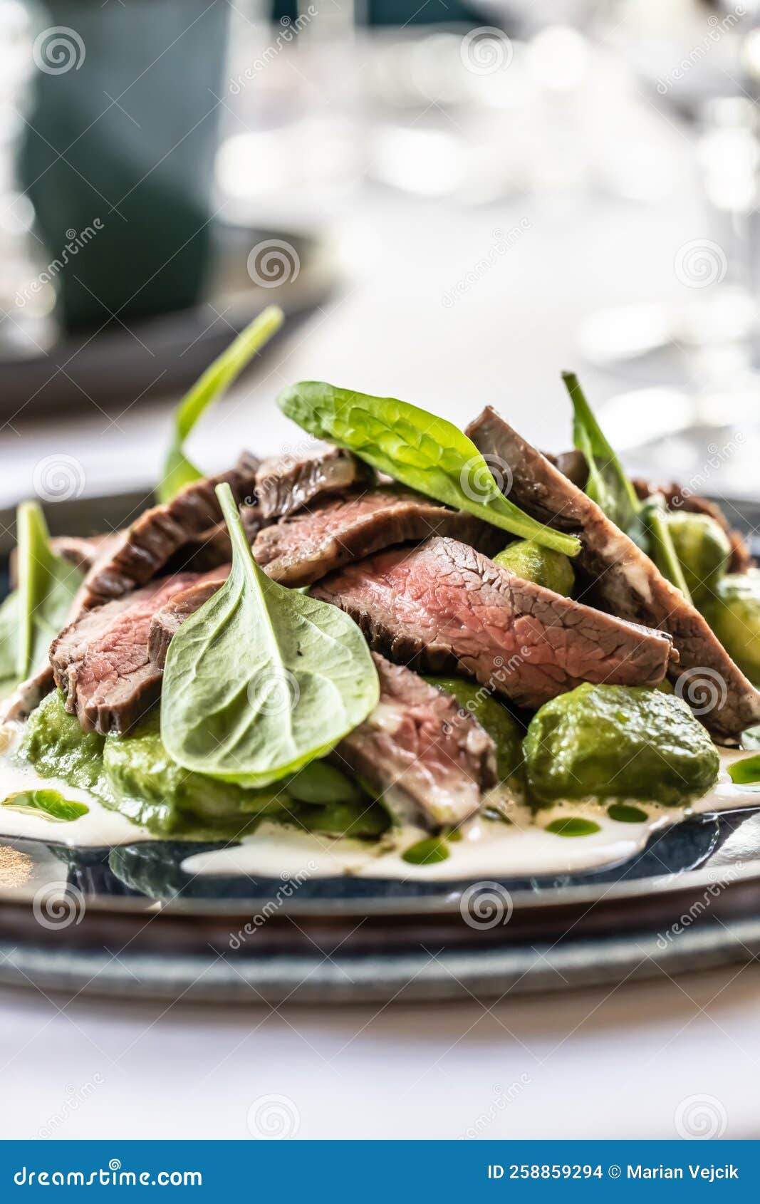 Creatively Cooked Beef Flank Steak with Spinach Gnocchi Served on a ...
