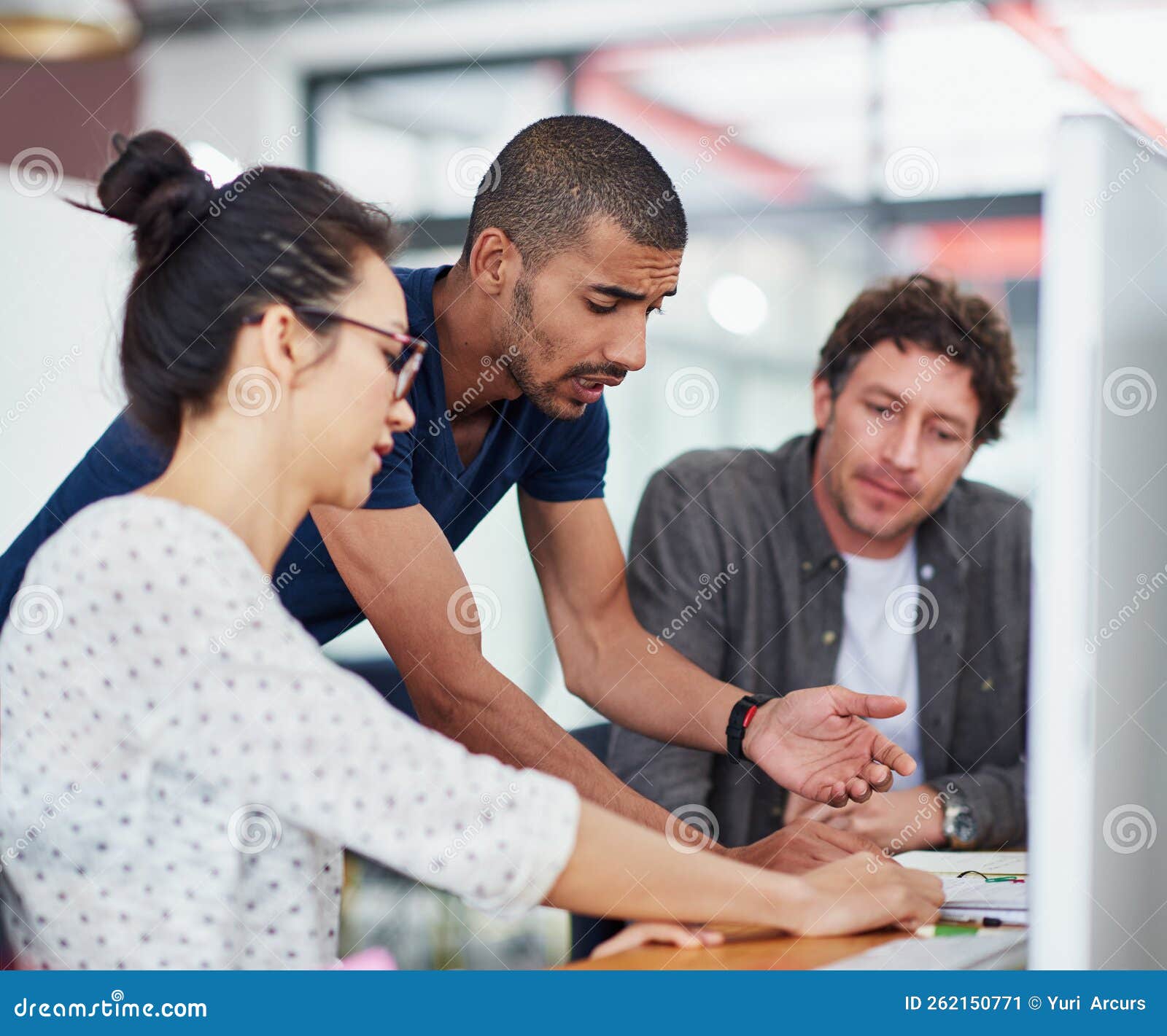 Creatives at Work. a Group of Designers Talking Together while Sitting ...