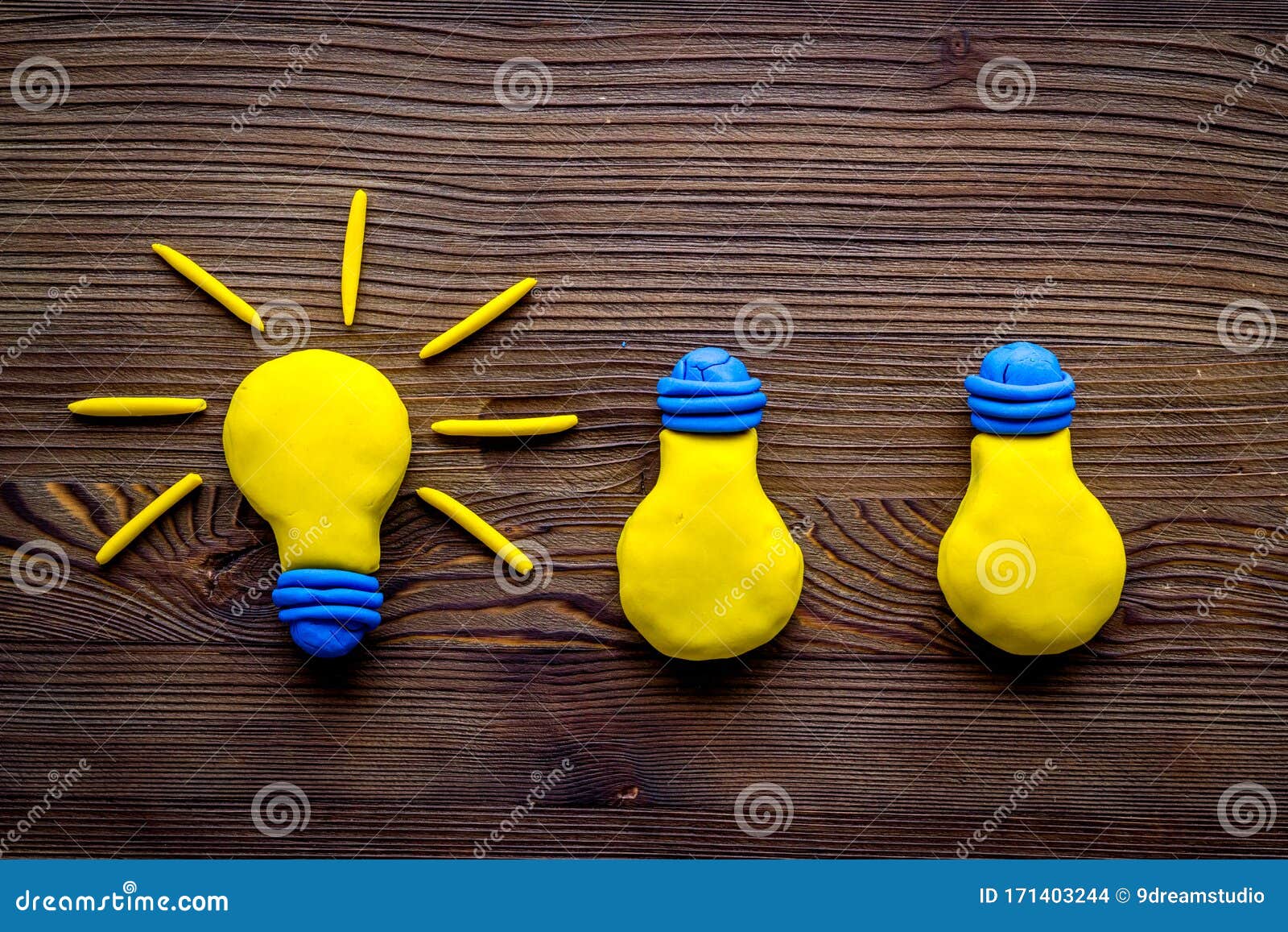 Creativity Concept. Bulb Icons on Dark Wooden Background Top-down Stock ...