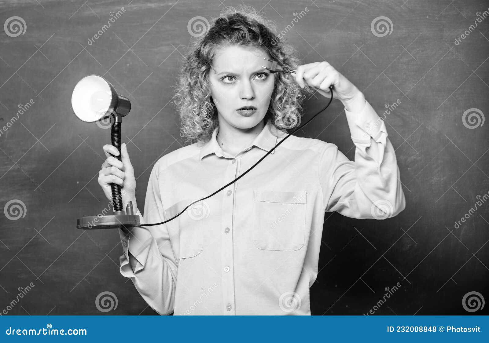 Creativity and Inspiration. Teacher Hold Table Lamp in Hand Chalkboard ...