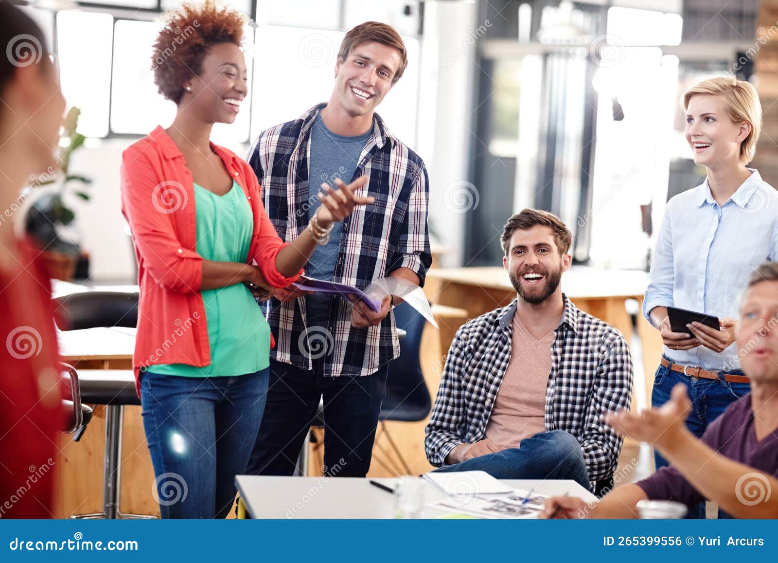 Creativity Thrives in this Office. a Group of Coworkers in a Meeting ...