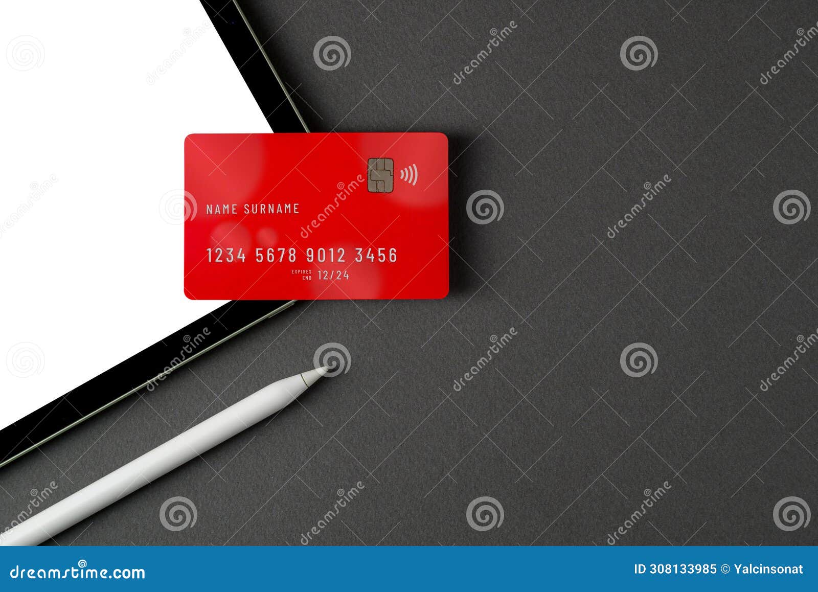 Credit Card Lying on Tablet with Blank Screen on Dark Gray Table Stock ...