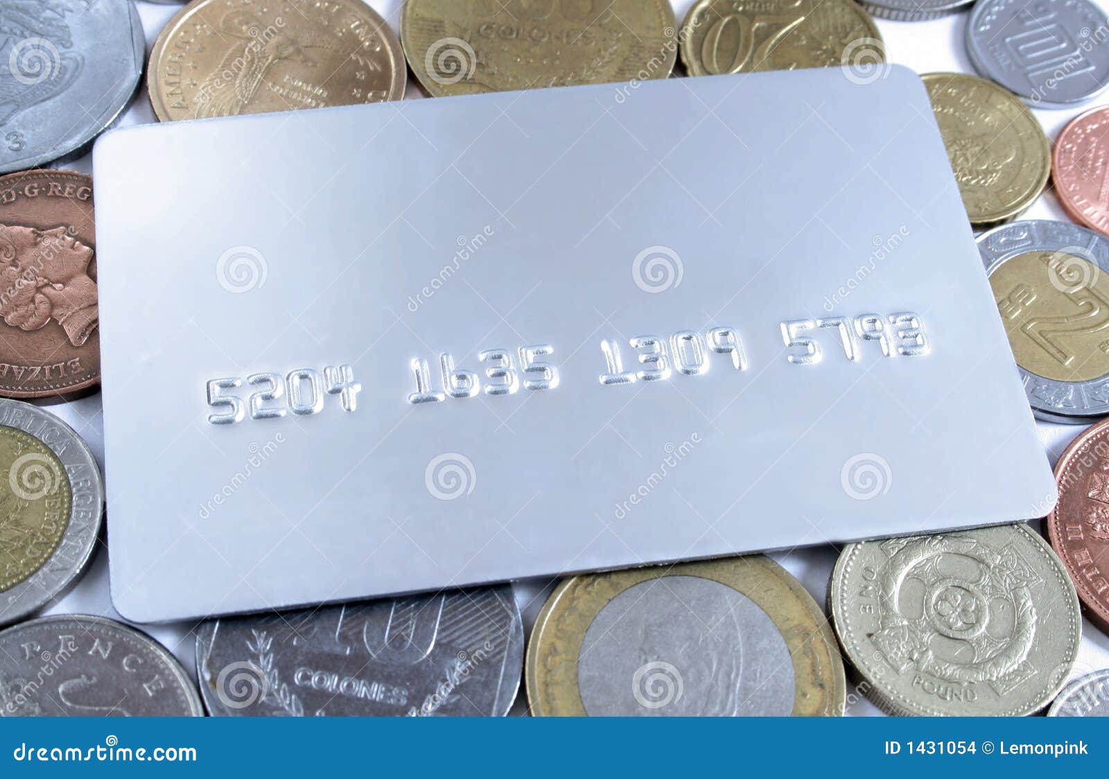 Credit card over coins stock photo. Image of financial - 1431054