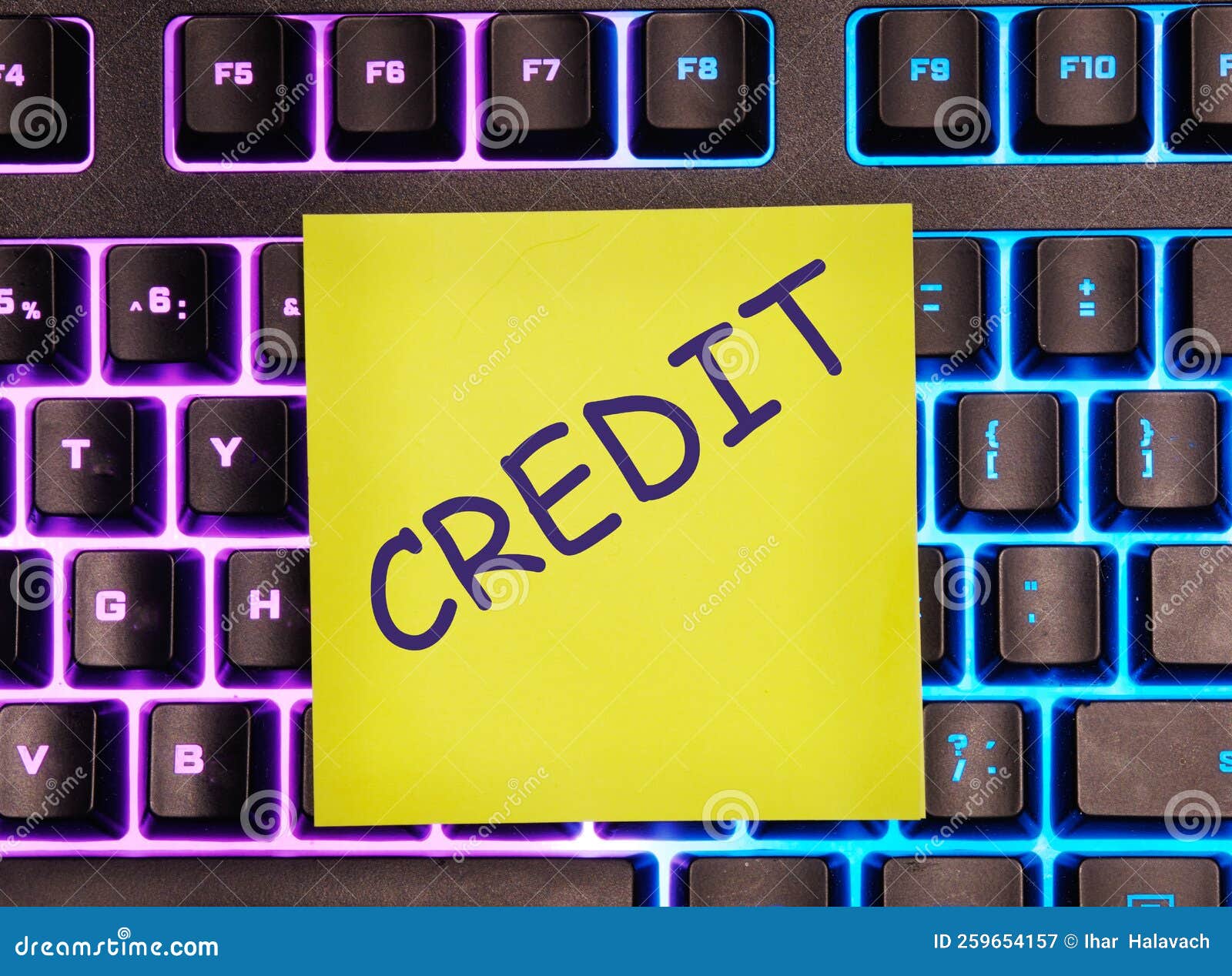 CREDIT Text on a Yellow Sticker on a Glowing Laptop Keyboard Stock ...