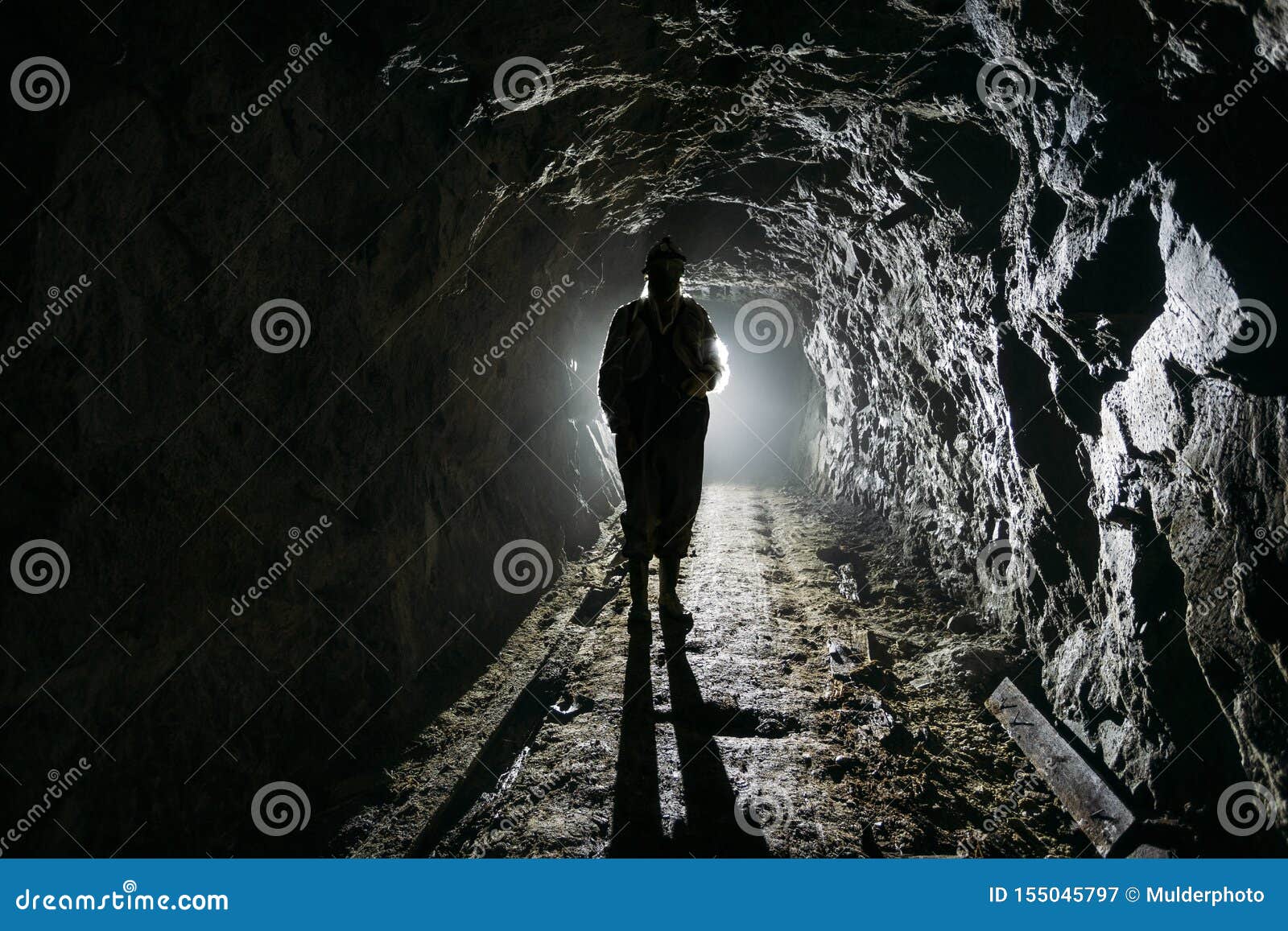Creepy Backlit Human Silhouette Inside Dark Abandoned Mine Stock Image ...