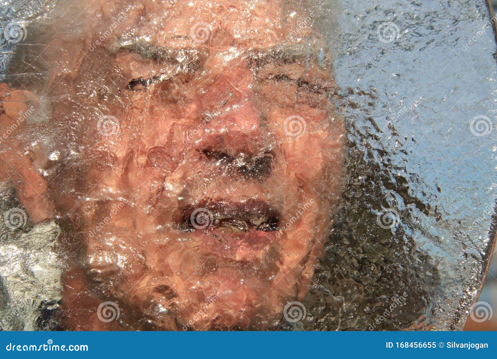 A Creepy Deformed Mans Face Under Layer of Ice Stock Image - Image of ...