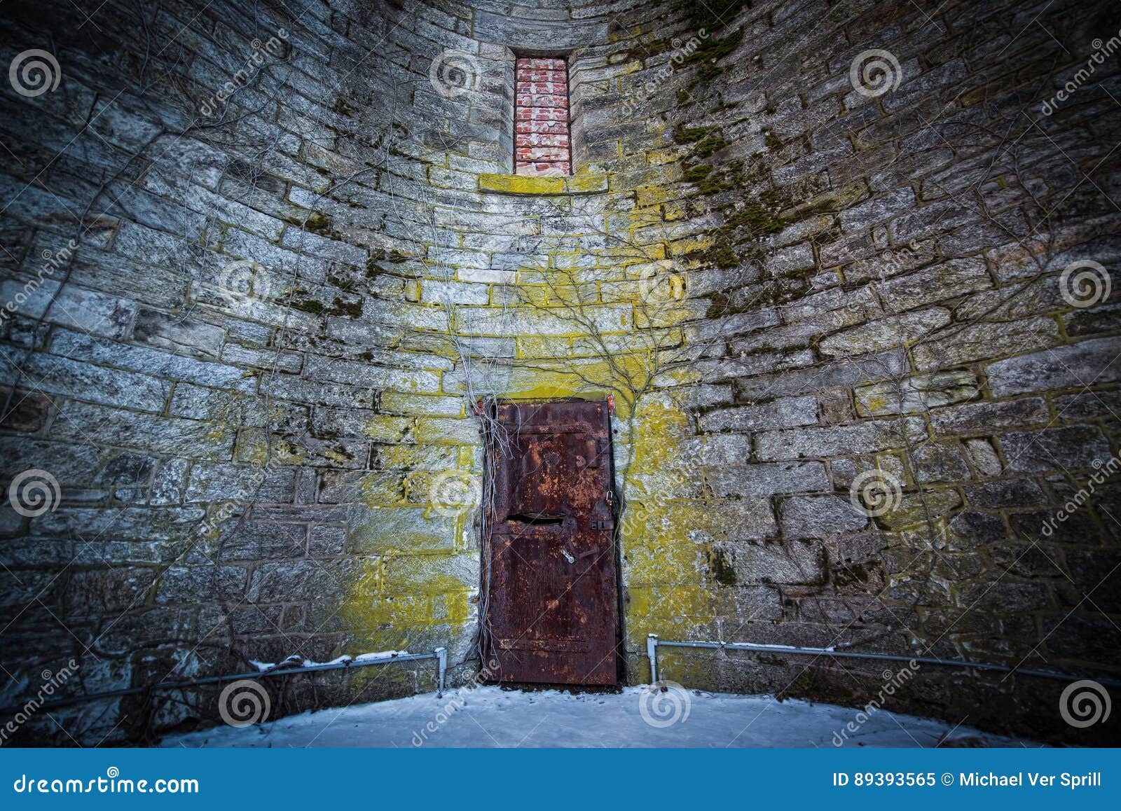 Creepy Rusty Door in a Brick Wall Stock Image - Image of center ...