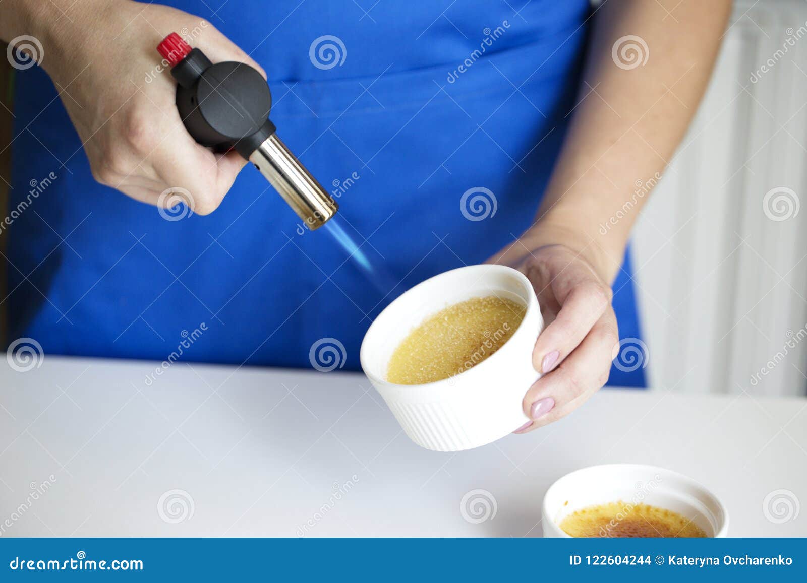 Creme Brulee Dessert Caramelizing Using a Torch Stock Photo - Image of ...