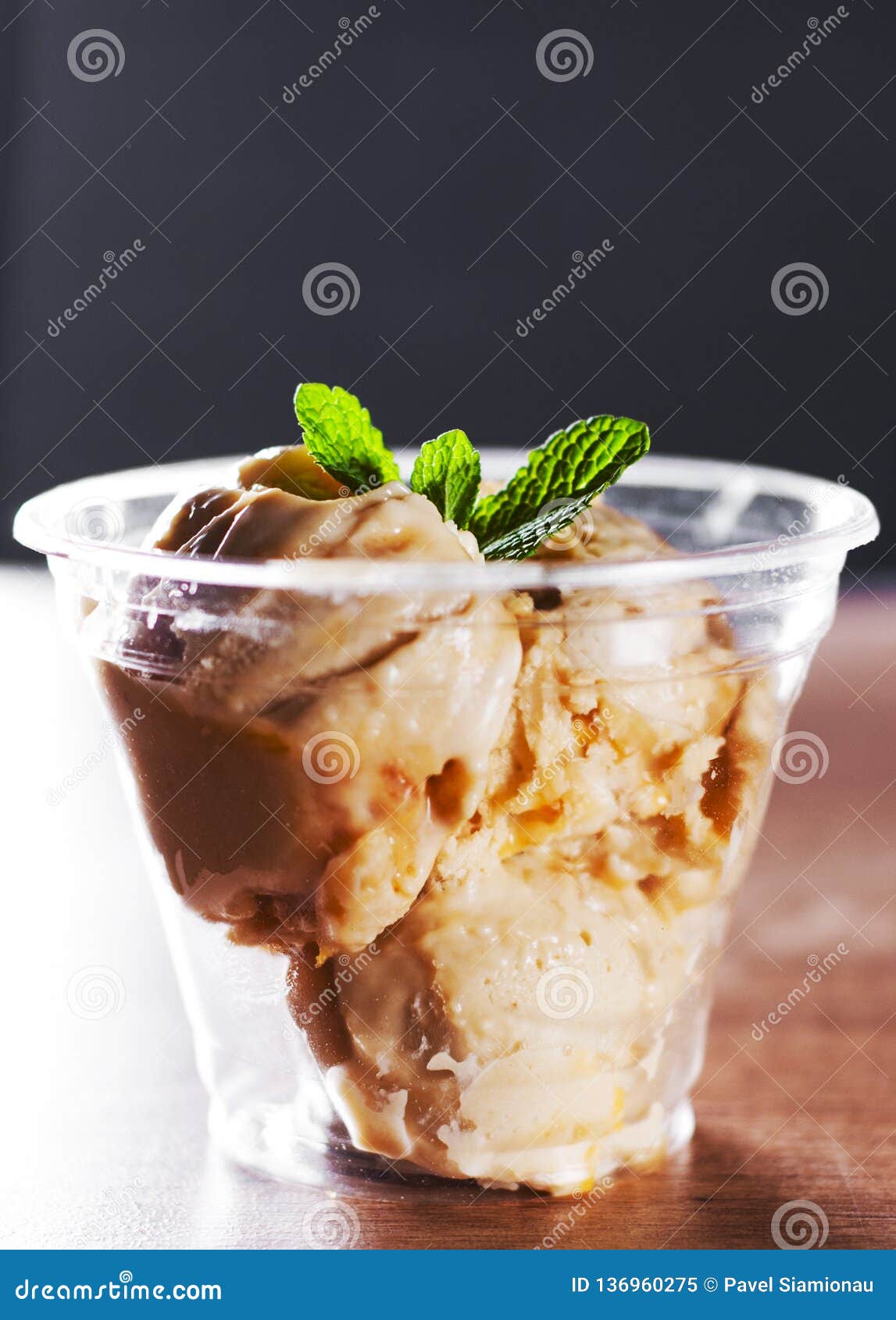 Creme Brulee Ice Cream in a Plastic Cup with Mint Stock Image - Image ...