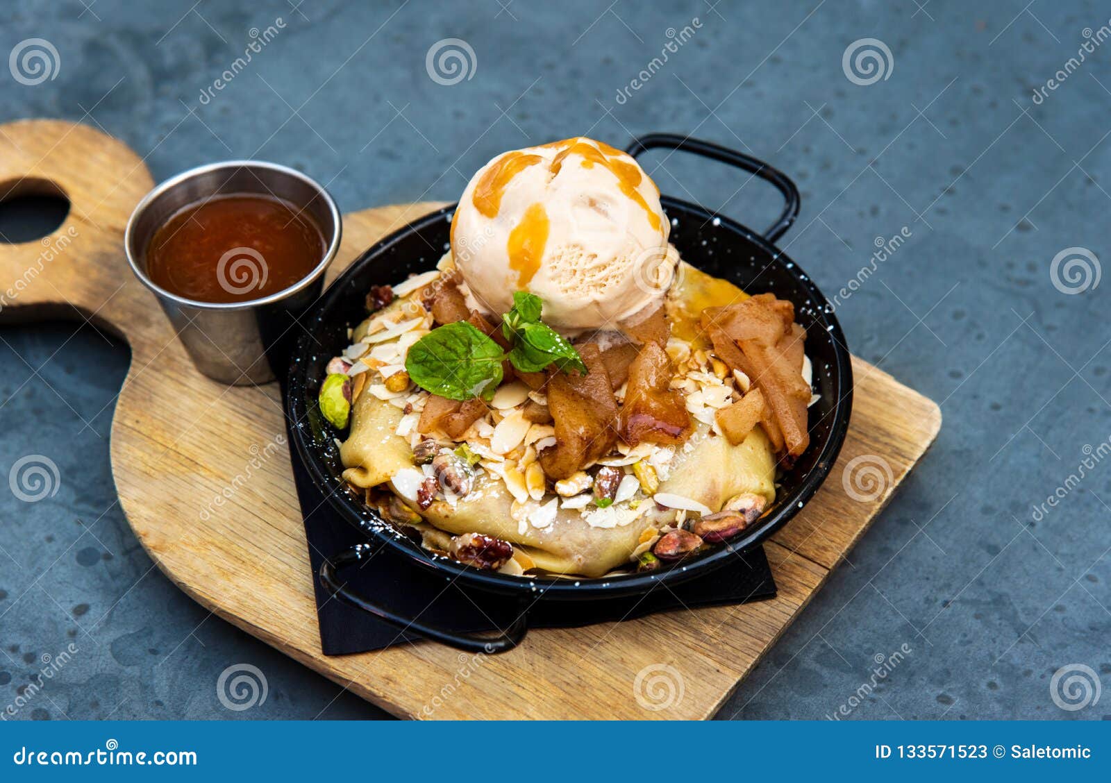 Crepe with Ice Cream and Various Nuts Stock Image - Image of sauce ...