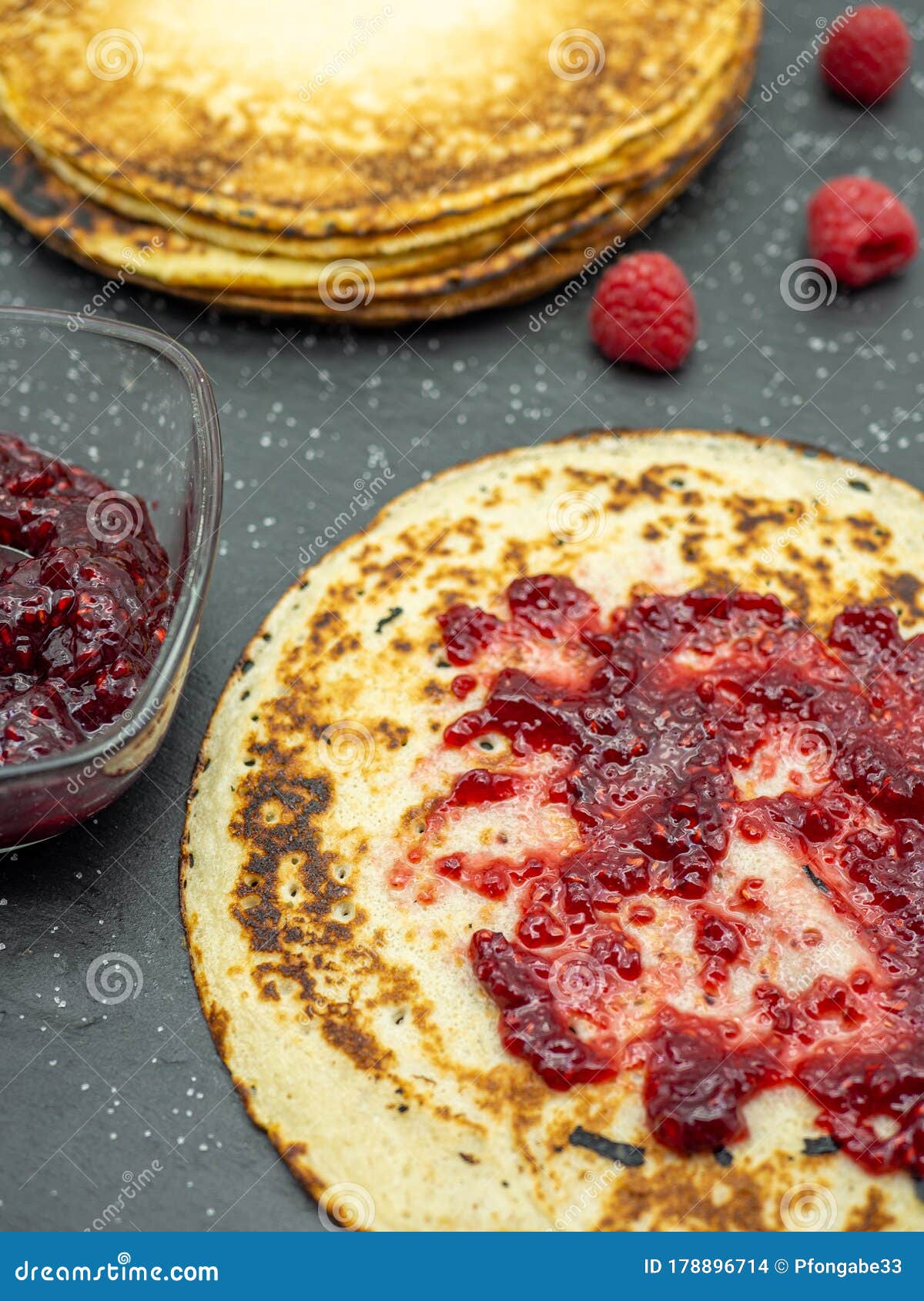 Crepes Filled with Raspberry Jam and Fresh Raspberry on Slate Stock ...