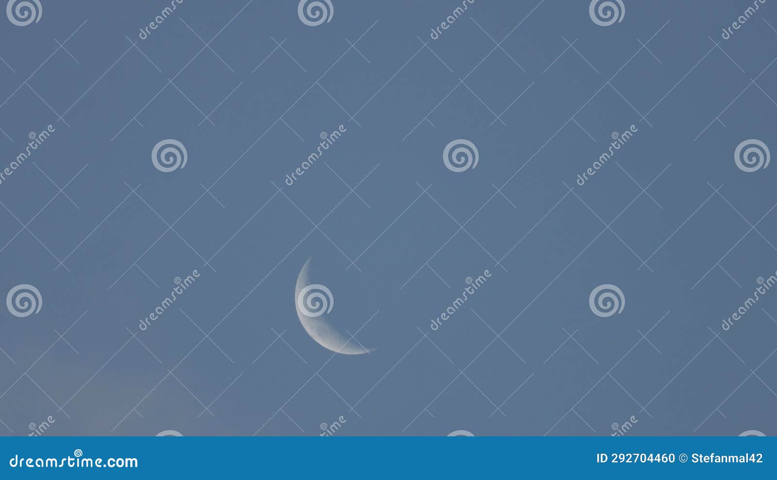 Crescent Moon in Blue Sky during Day with Faint Clouds Wisping Over ...