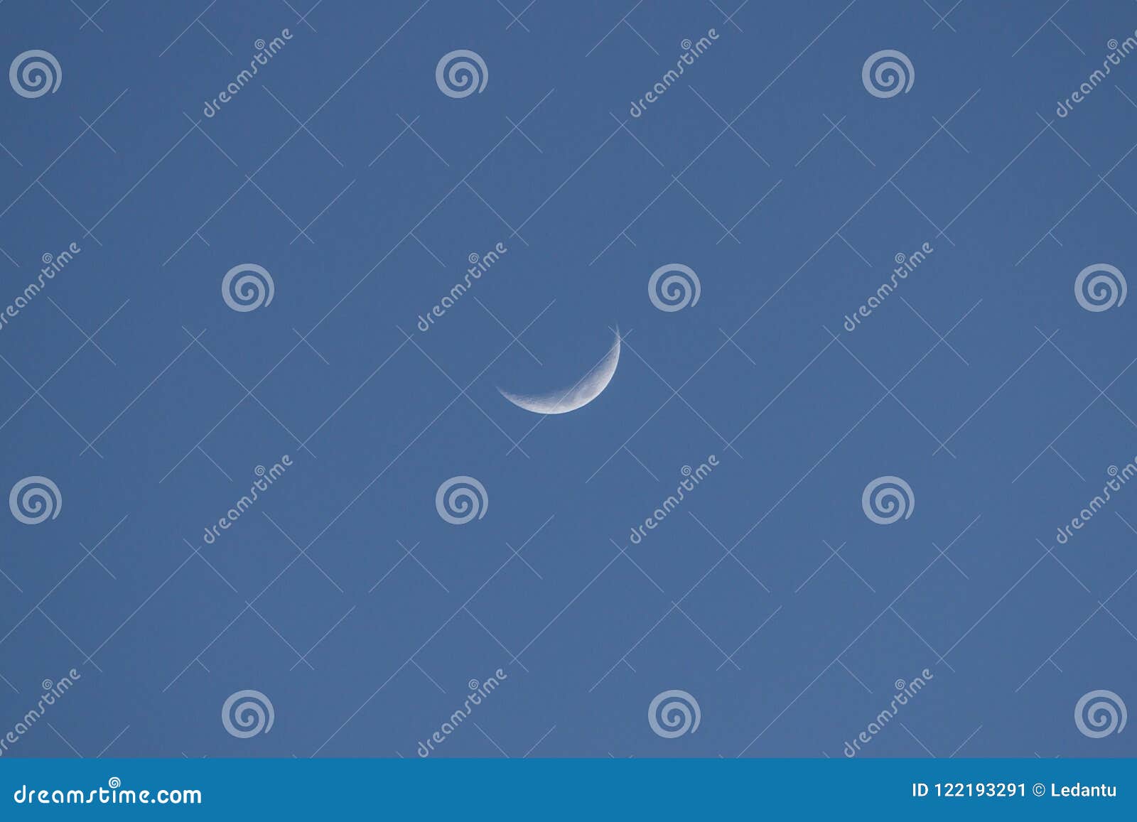 A Crescent Moon in the Center of Blue Sky Stock Image - Image of ...