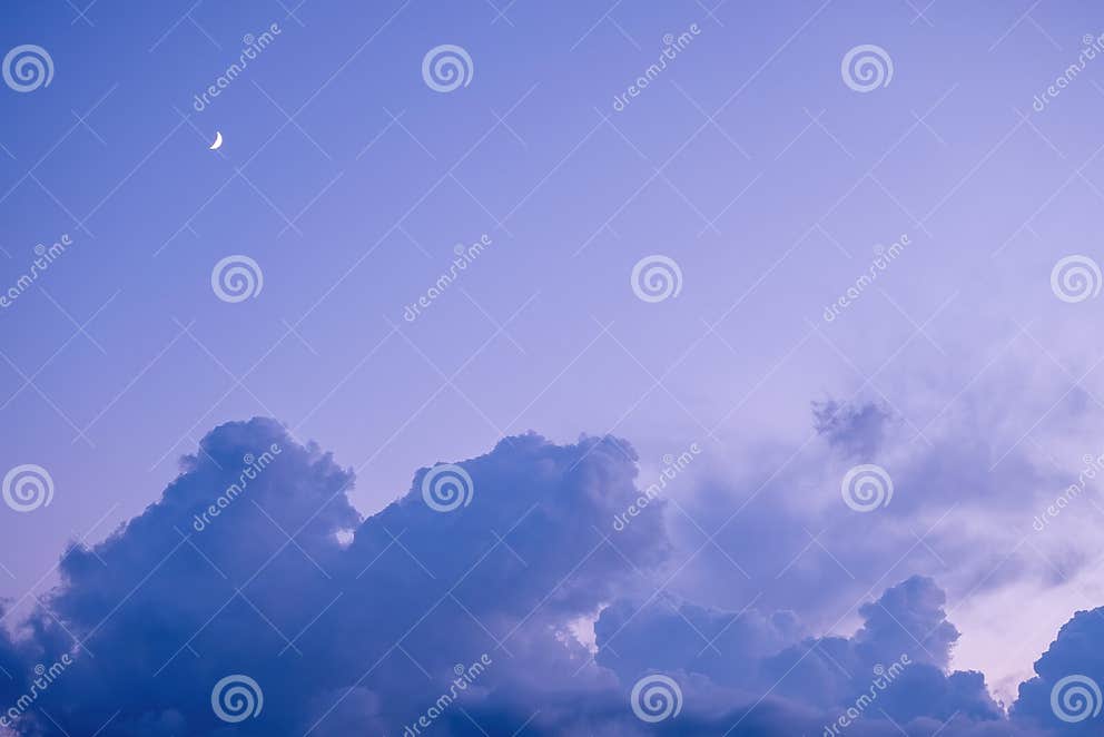 Crescent Moon Over Dramatic Cloudscape at Dusk Stock Photo - Image of ...