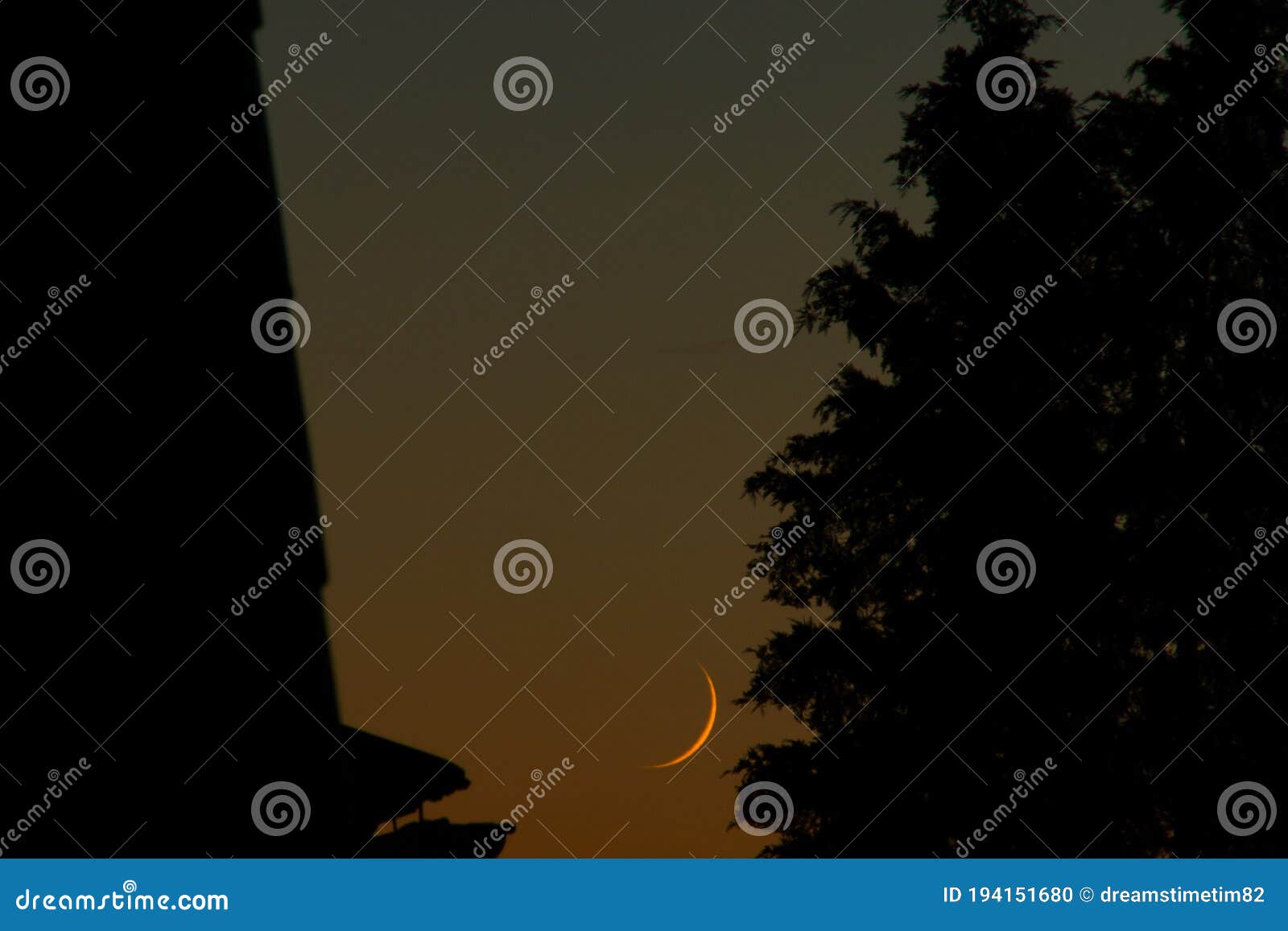 The Crescent Moon Rising in the Evening Stock Photo - Image of ...