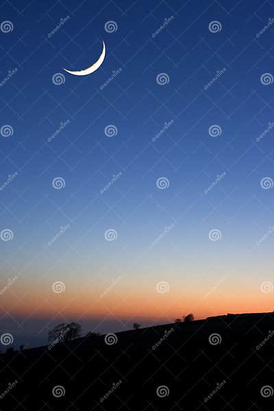 A Crescent Moon at Sunset Above Stock Photo - Image of natural, horizon ...