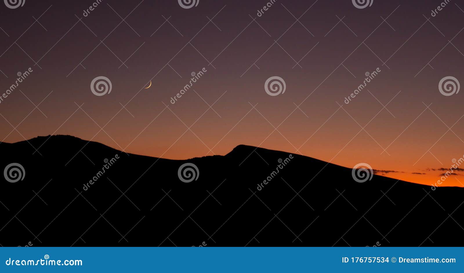 Crescent Moon and Sunset Over Silhouette of Desert Ridge on Fall ...