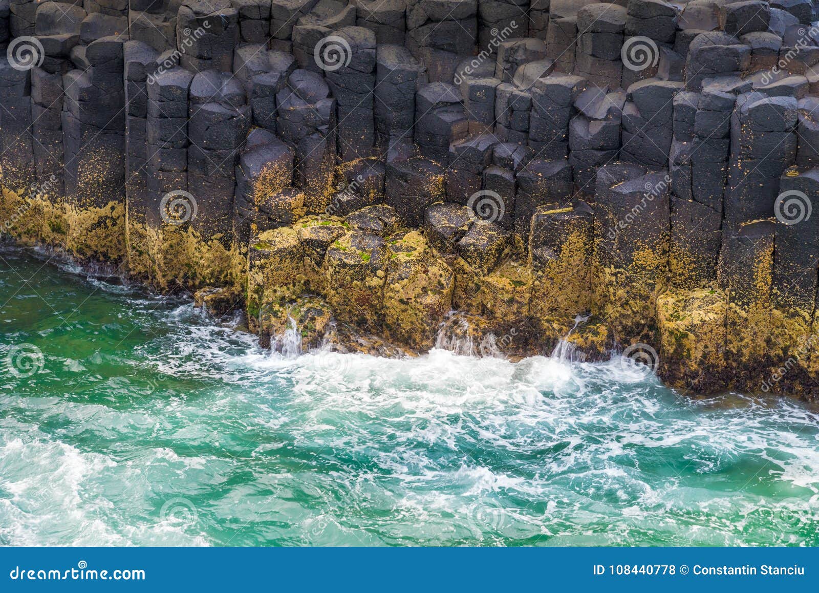 Crescent Shaped Hexagonal Rock Formations Stock Photo - Image of cliff ...