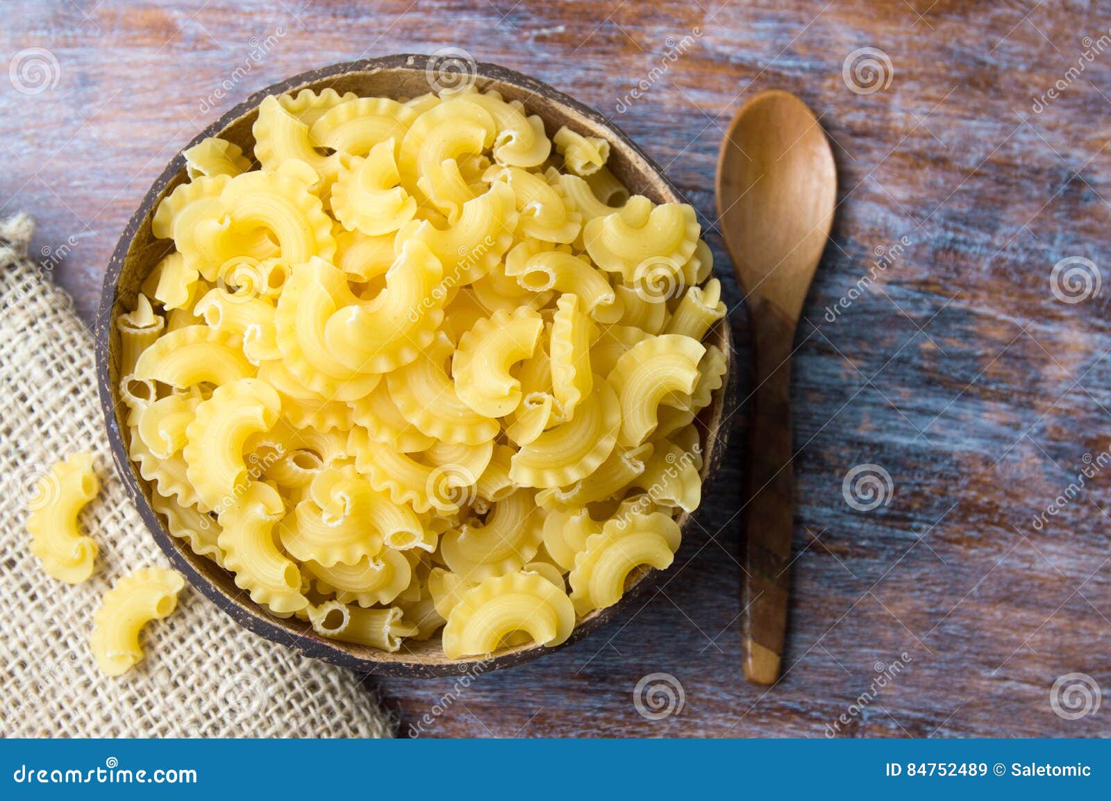 Creste Di Gallo Pasta with a Wooden Spoon Stock Image - Image of ...